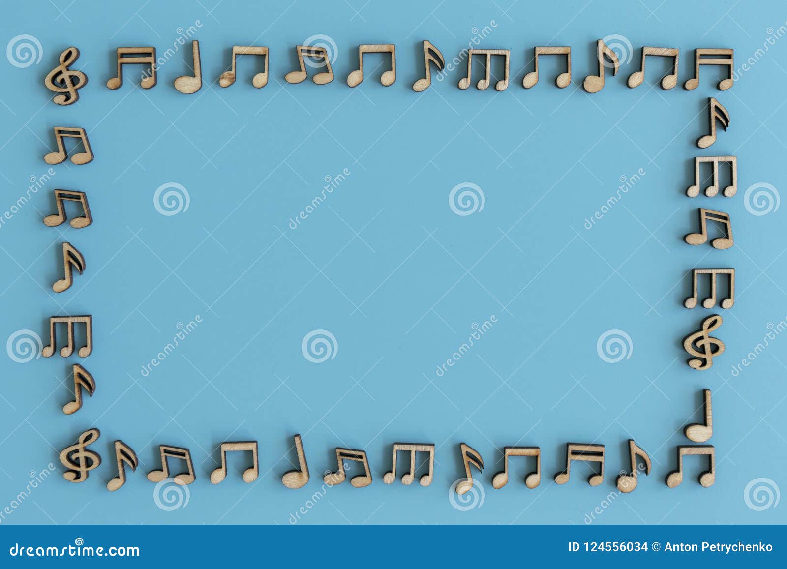 Frame From Musical Notes On A Blue Background. Wooden Notes On A Blue ...
