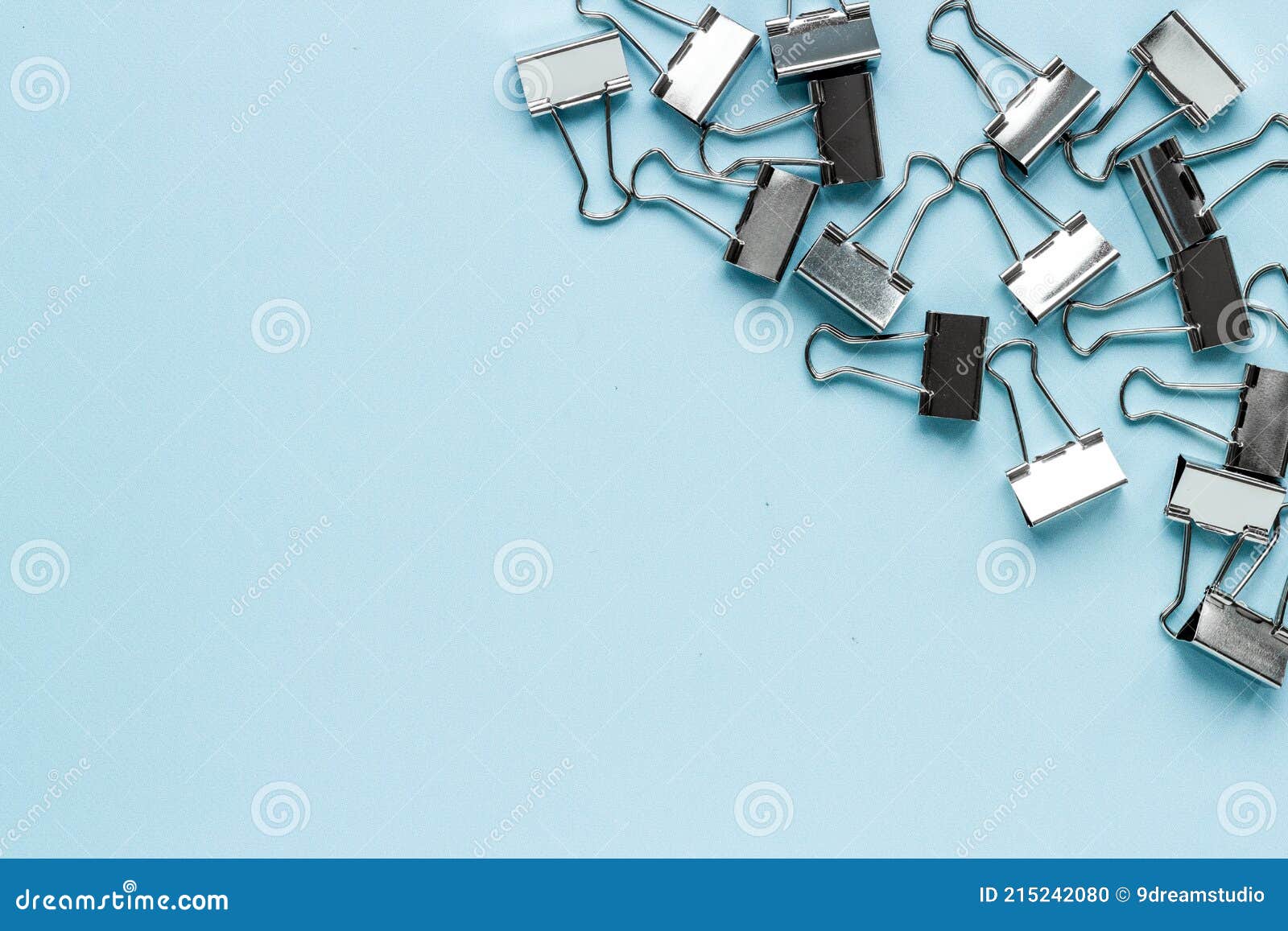 Frame of Silver Paper Binder Clips Top View. Office Supplies Pattern ...