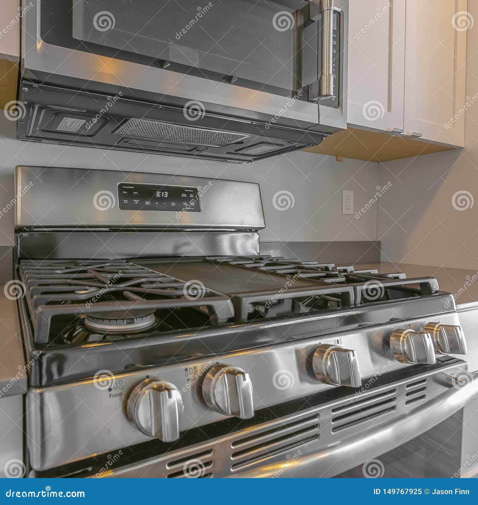 Frame Square Close Up of the Range Under Wall Mounted Microwave Inside ...