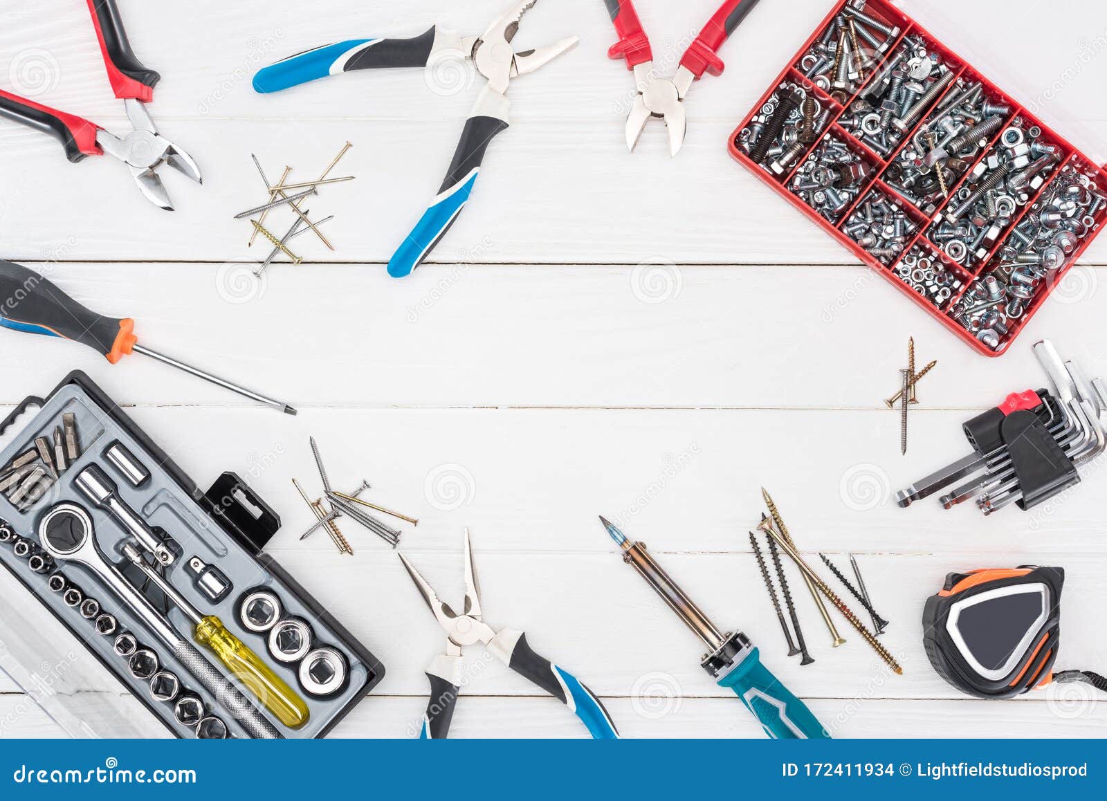 Frame of Tools with Tool Boxes on White Wooden Surface Stock Photo ...