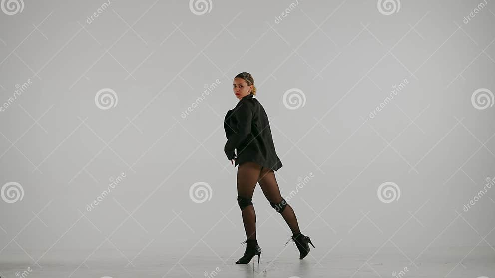 Framed On A White Gray Background Young Woman Demonstrating Dance