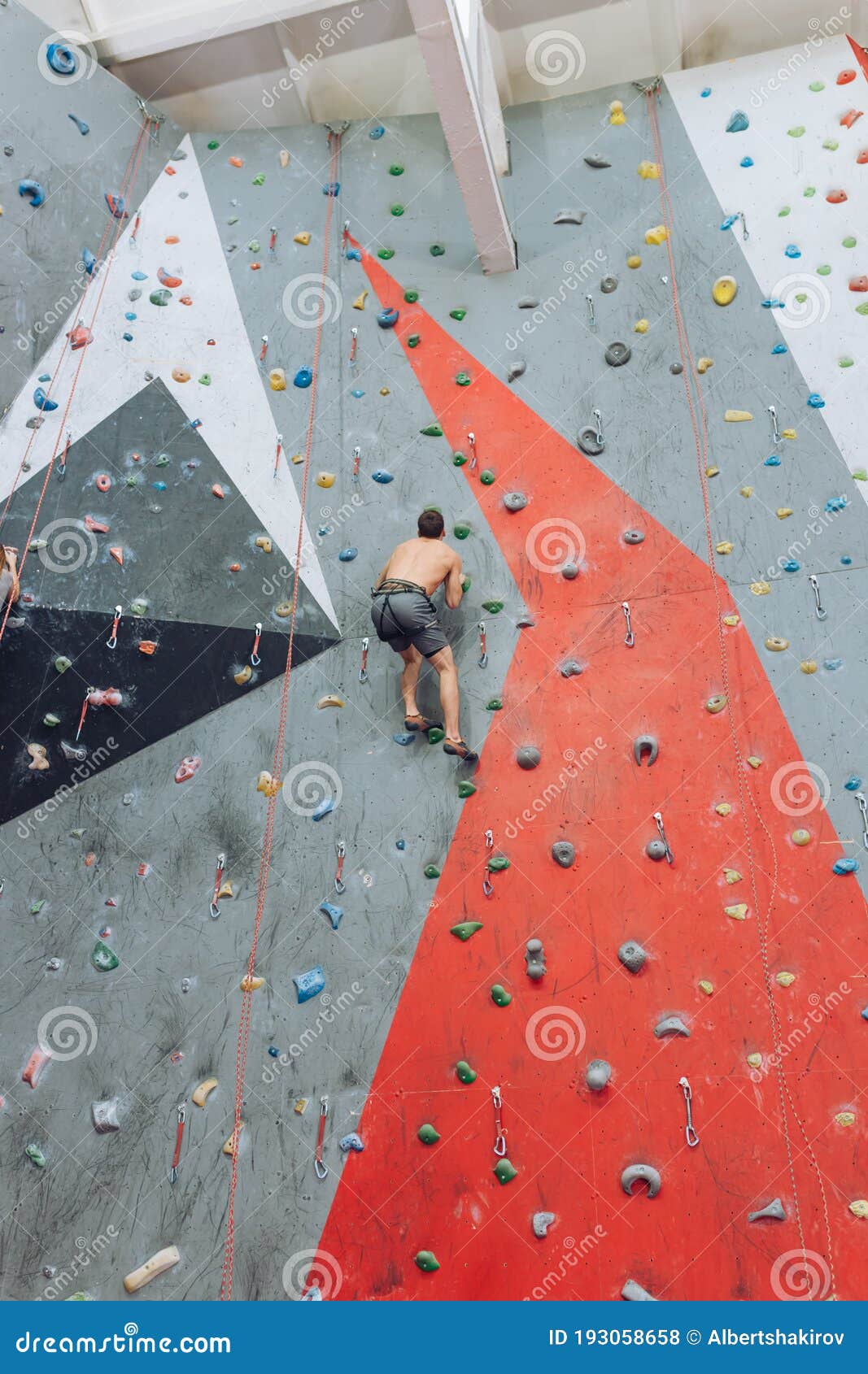 Free Ambitious Young Man Climbing on the Artificial Wall Stock Photo ...