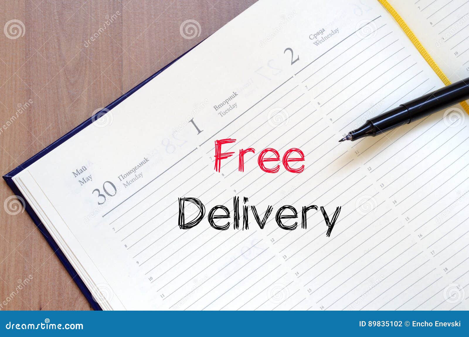 Free Delivery Text Concept on Notebook Stock Photo - Image of courier ...