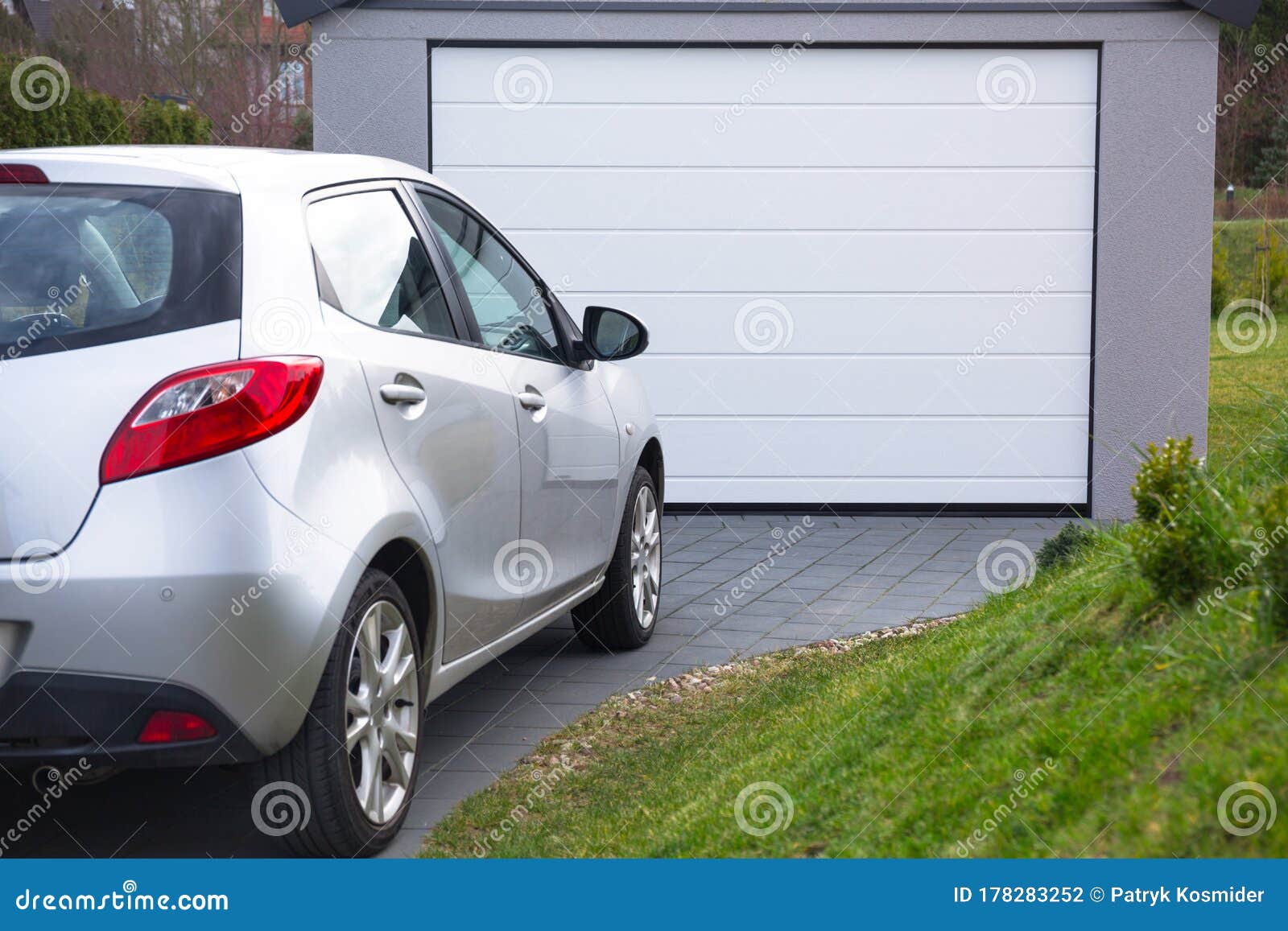 Free-standing Garage in the Garden with a Car Parked in Front of the ...
