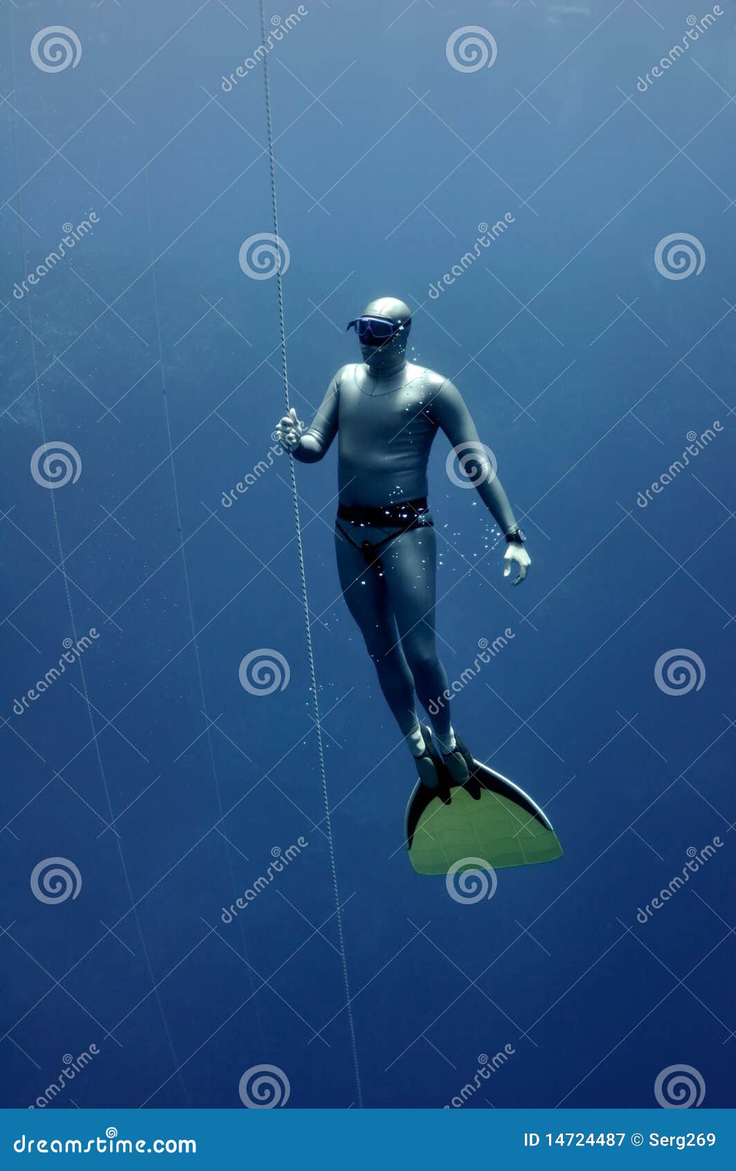 Freediver slowly raises up stock image. Image of ocean - 14724487
