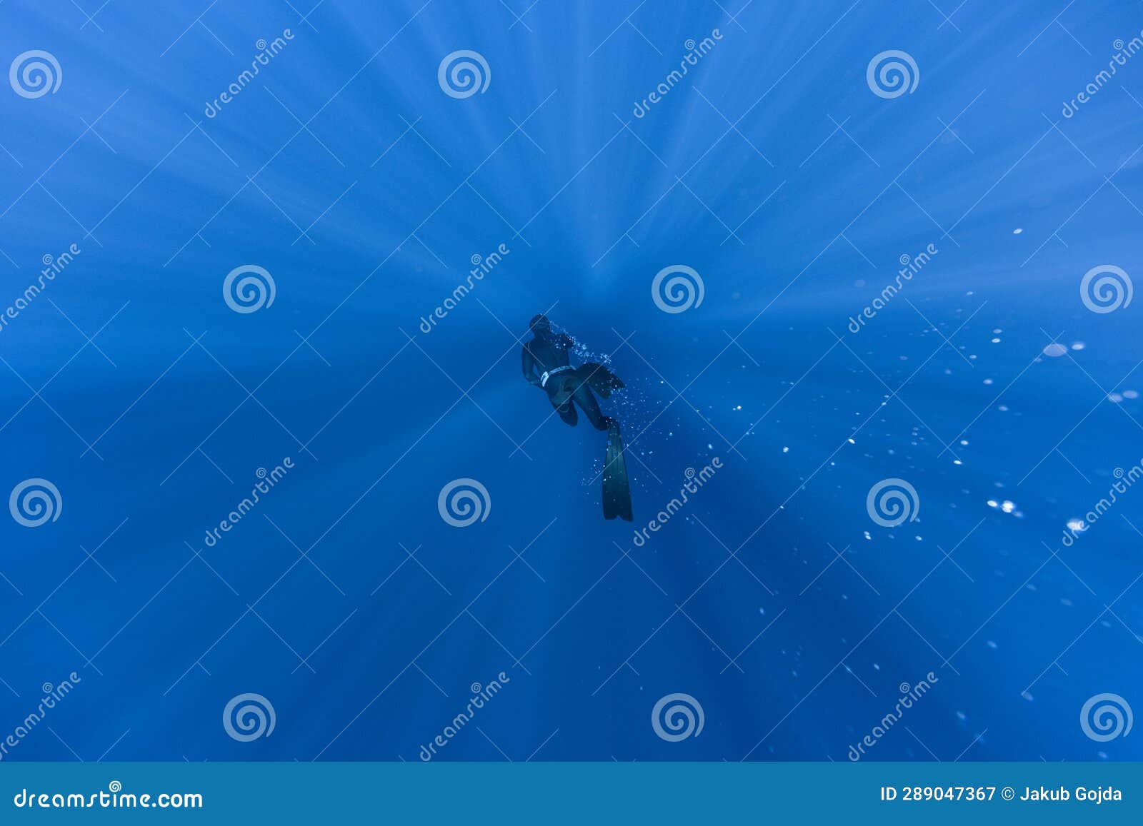Freediver Swimming in Deep Sea with Sunrays Stock Image - Image of ...