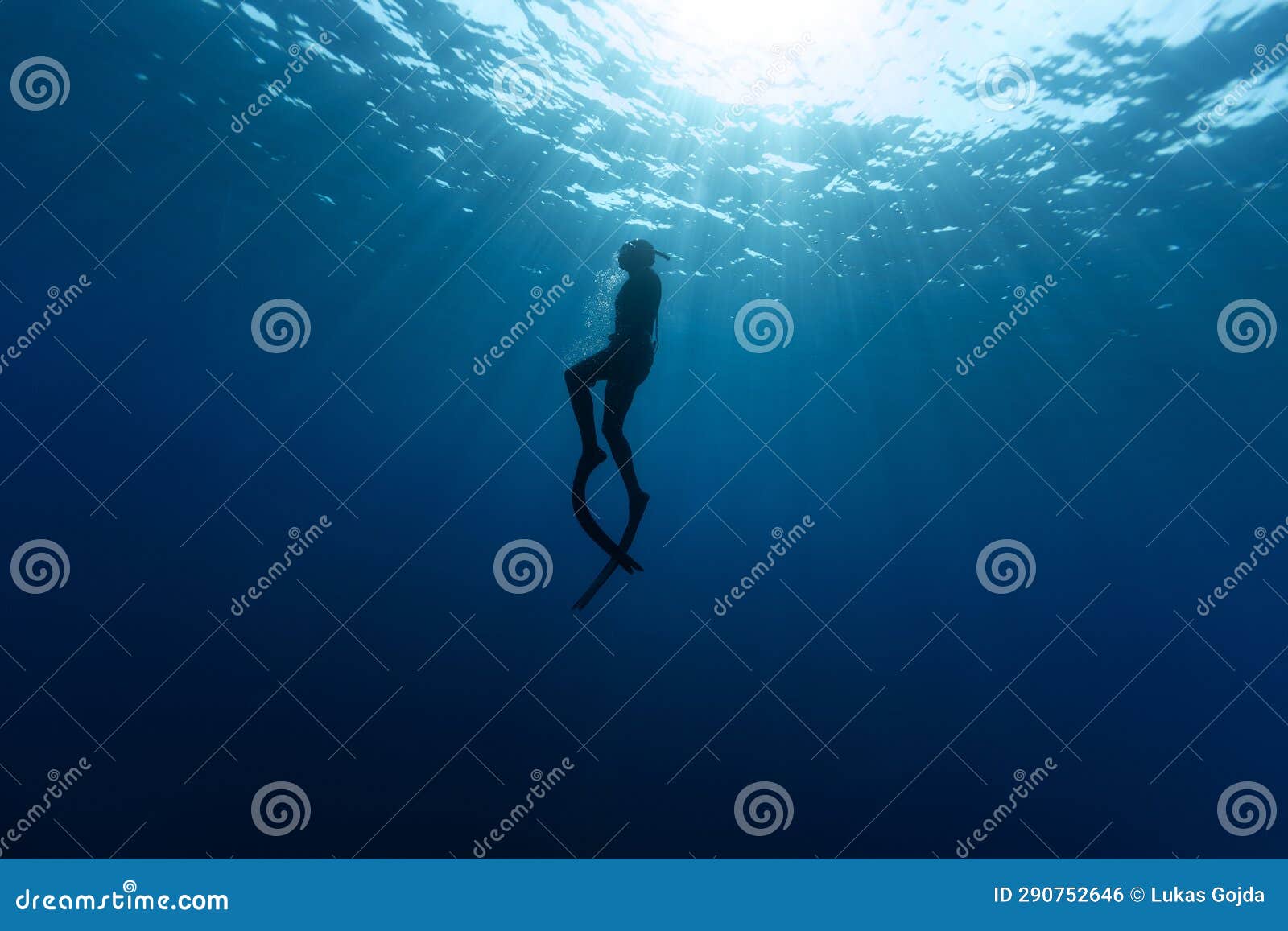 Freediver Swimming in Deep Sea with Sunrays Stock Photo - Image of ...