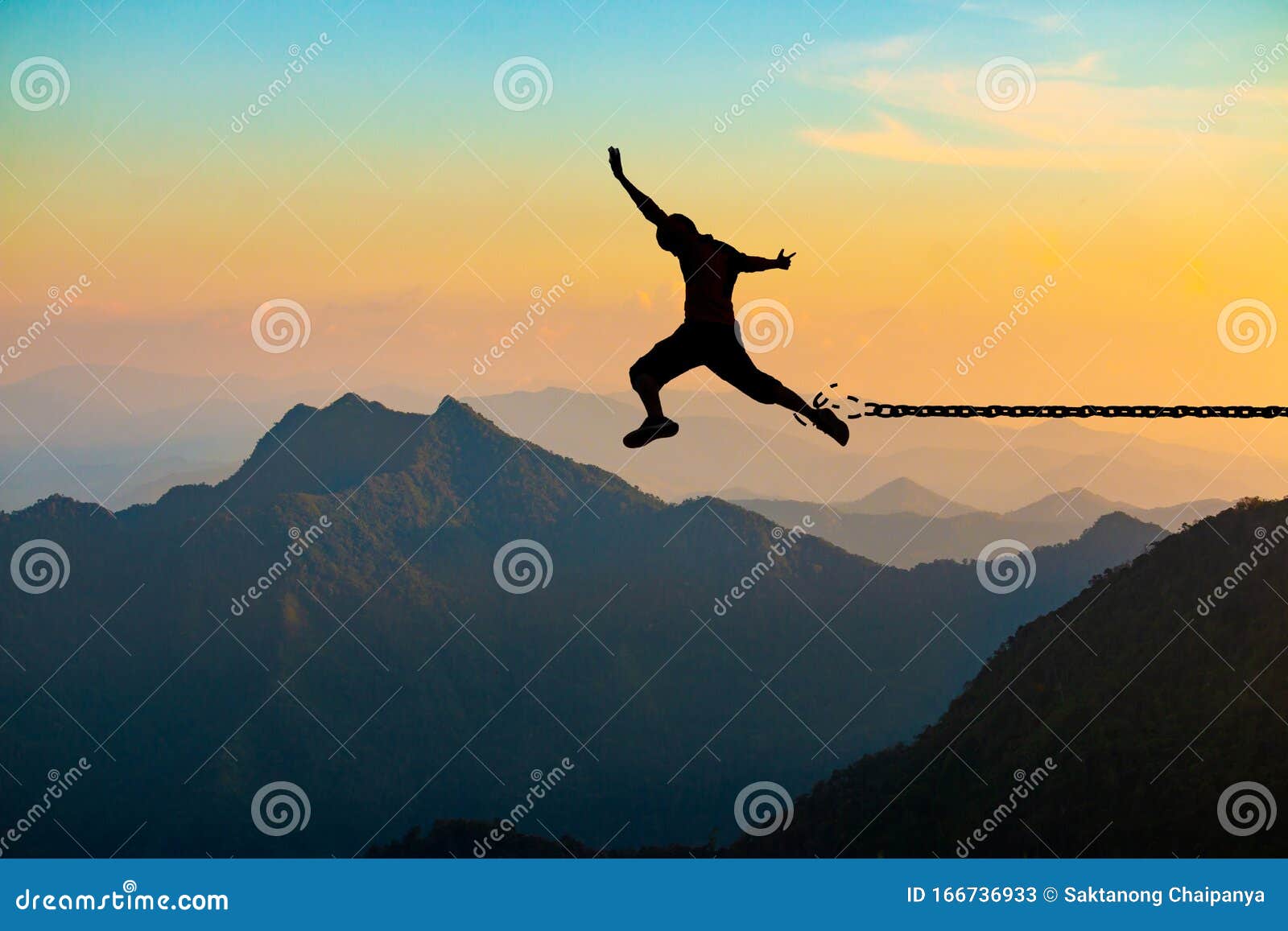 Freedom Concept, Silhouette Of A Man Jumping And Broken Chains At ...