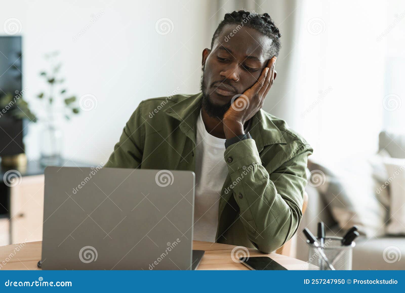 Freelance Stress Concept. Overworked Sad Black Man Sitting at Workplace ...