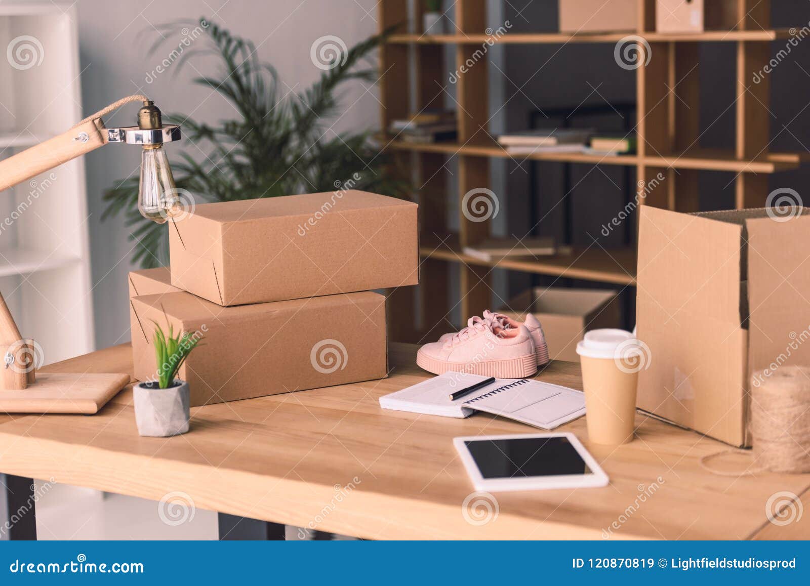 Freelance Worker Workplace with Cardboard Boxes, Notebook and Pair of ...