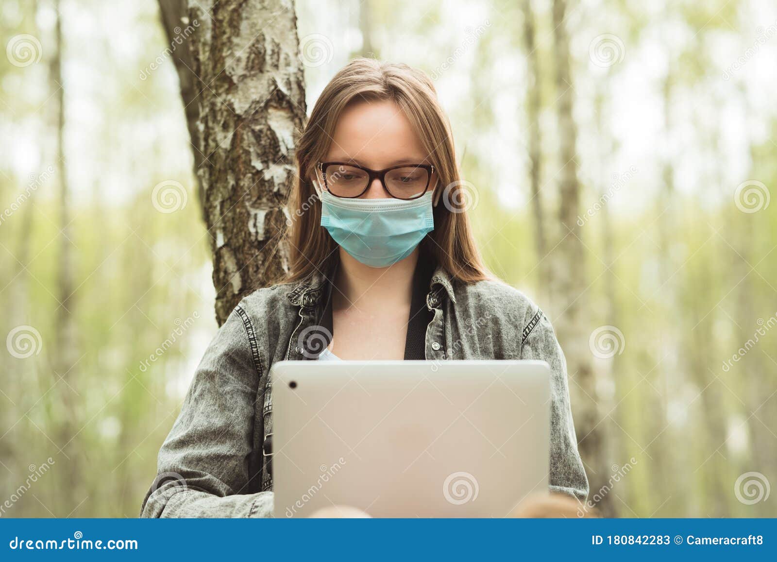 Freelancer During Quarantine In The Nature Woman In Mask Is Working On