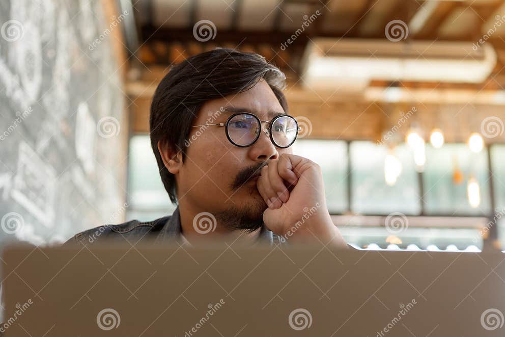 Freelancer is Thinking Idea or Trying To Solve a Problem at Cafe. a Man ...