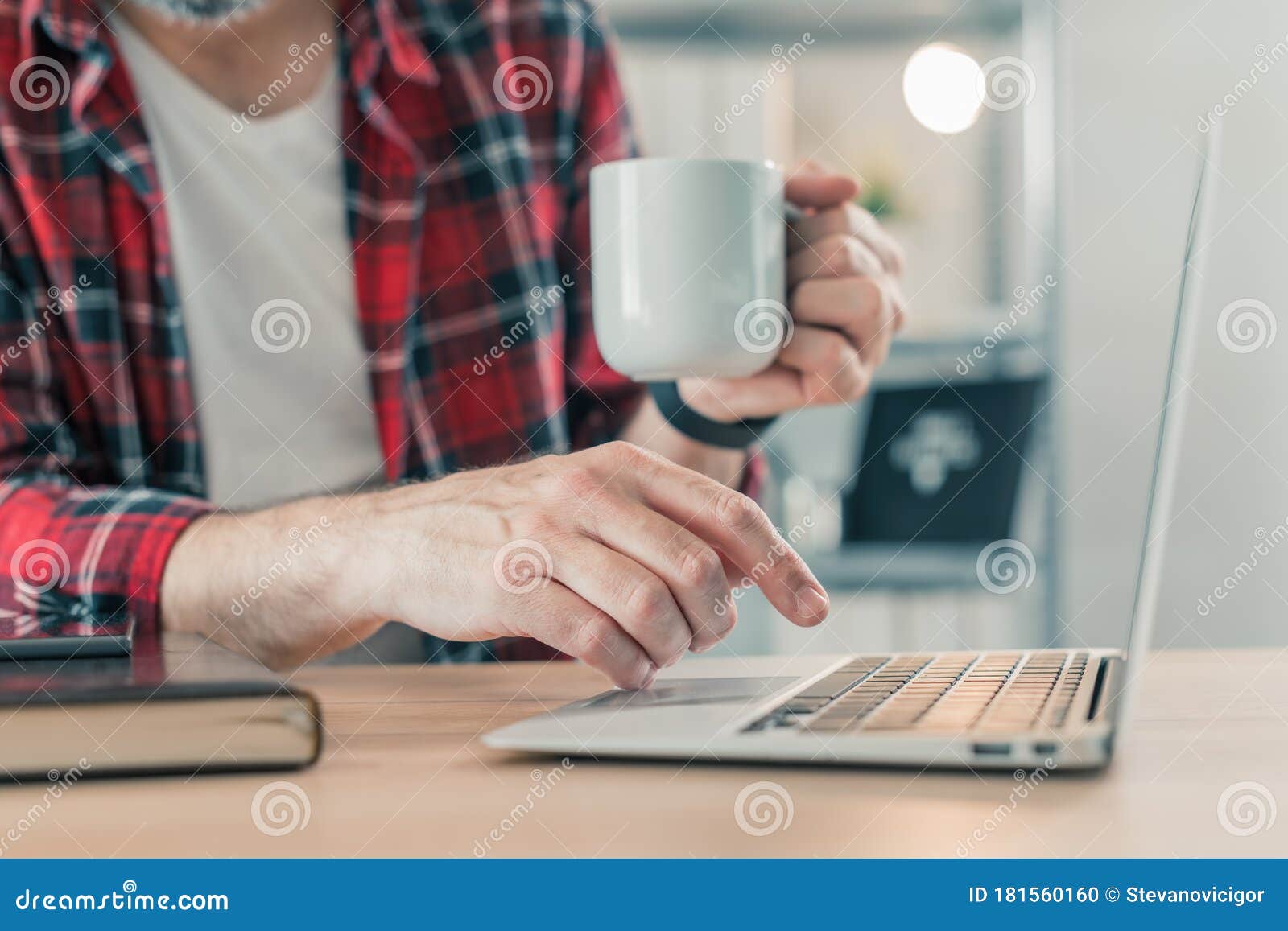 Freelancer Using Laptop Computer and Drinking Coffee in Home Office ...