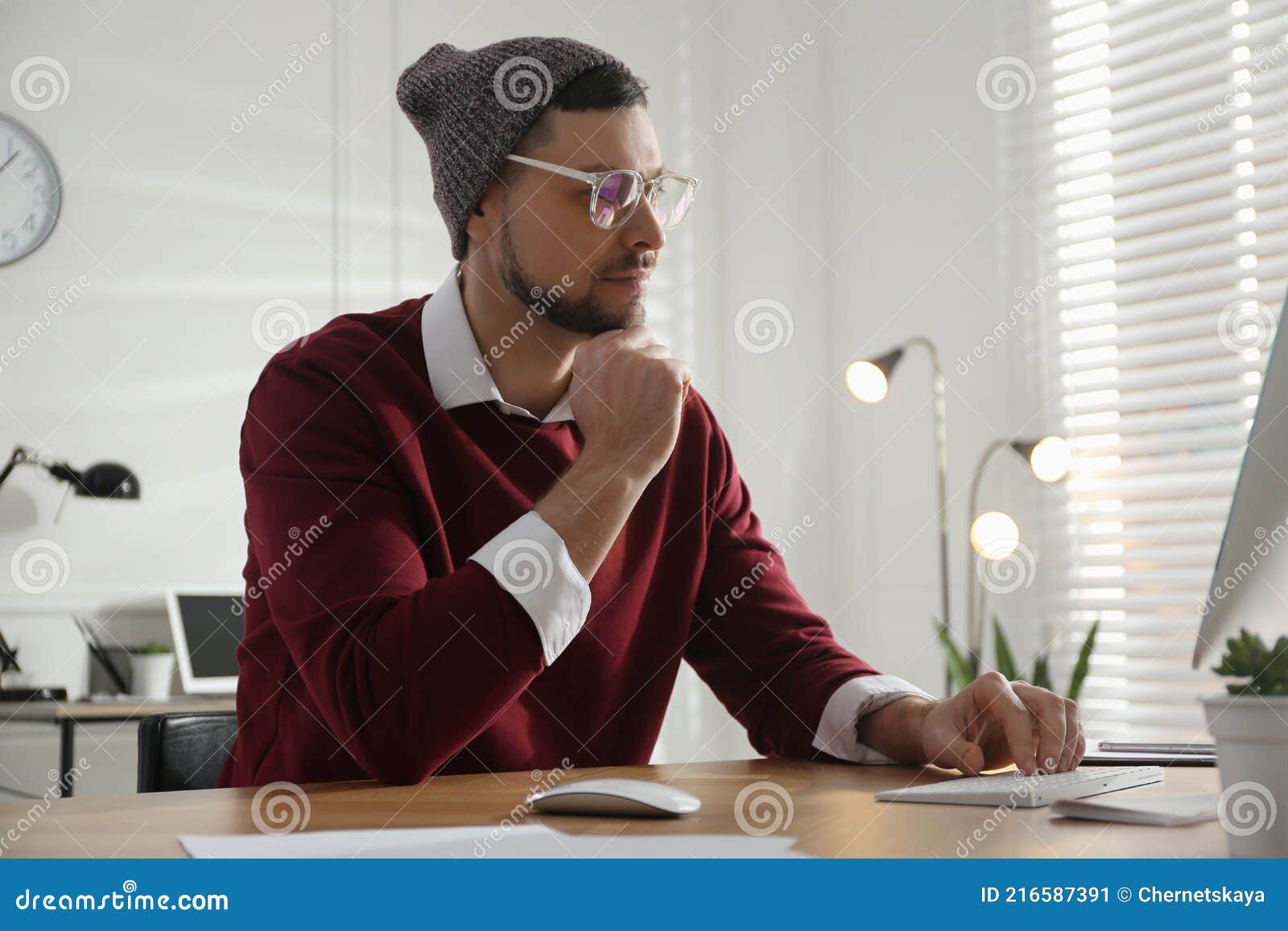Freelancer Working on Computer at Table Indoors Stock Image - Image of ...