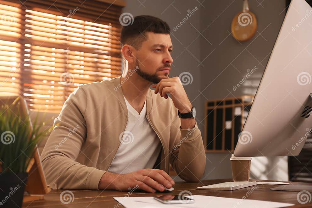 Freelancer Working on Computer at Table Indoors Stock Photo - Image of ...