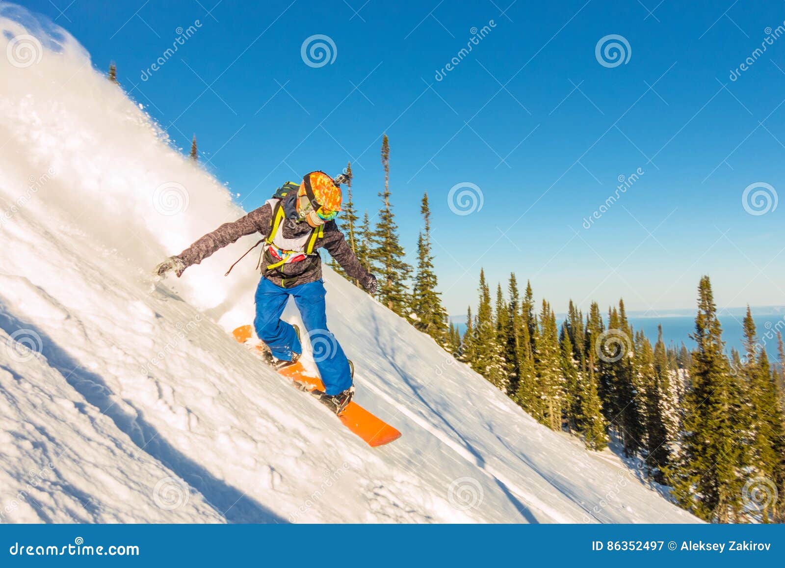 Freeride Snowboarder Slides Down a Steep Slope at Dawn Stock Image ...