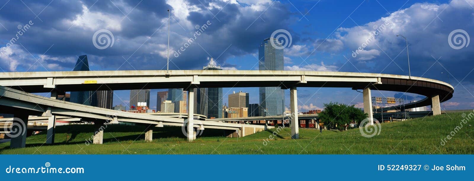 This is a Freeway Overpass with the Dallas Skyline Visible Behind it ...