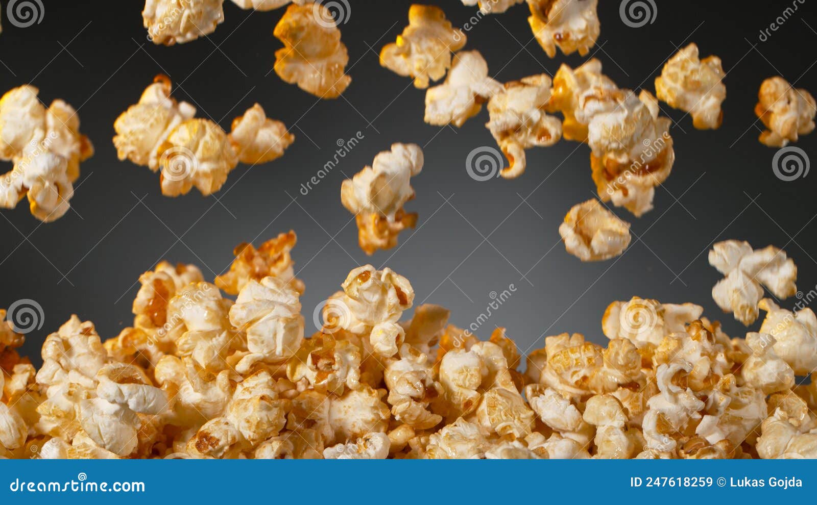 Freeze Motion of Popcorn Flying on Gradient Blue Background. Stock ...