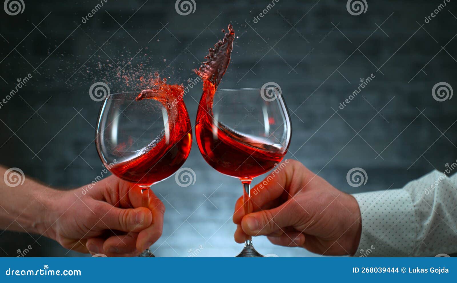 Freeze Motion Shot of Clinking Two Glasses of Wine Stock Photo - Image ...