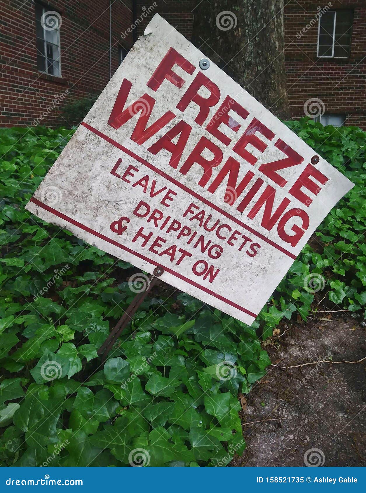 Freeze Warning Sign at Apartment Complex. Stock Image - Image of ...