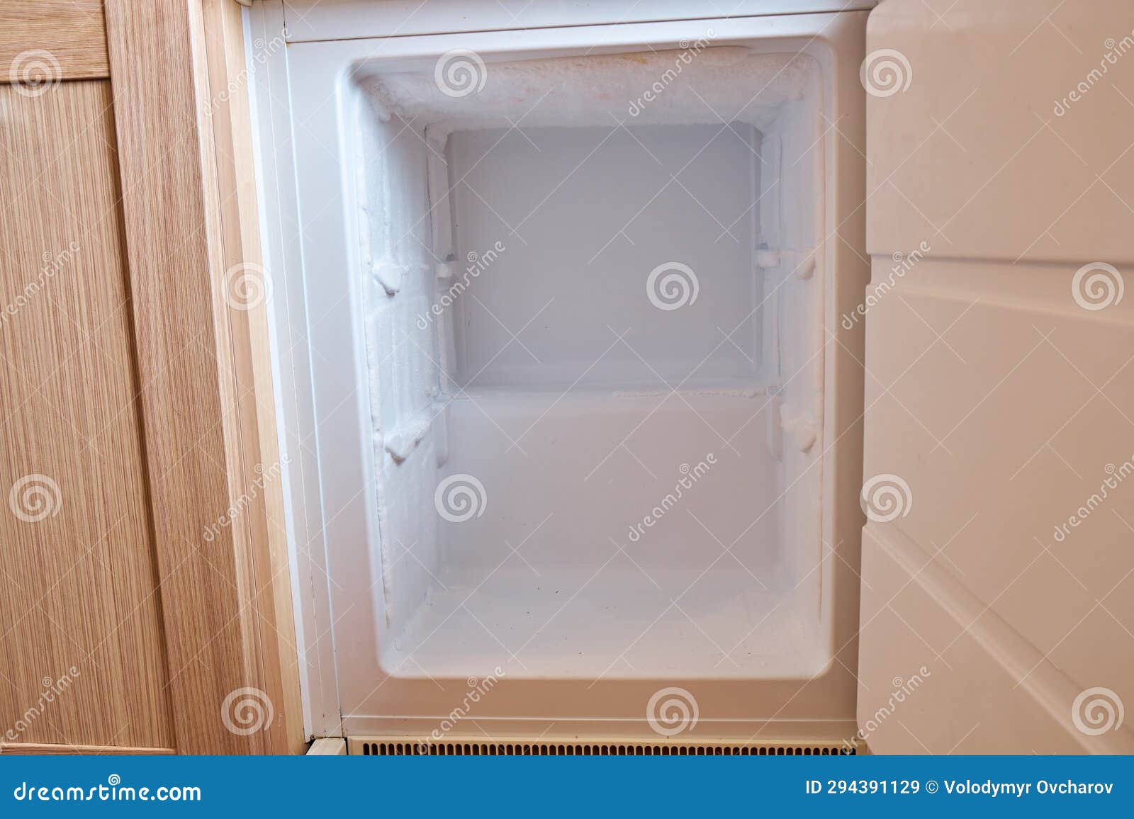Freezer with Ice on the Walls in the Built-in Refrigerator. Close-up ...