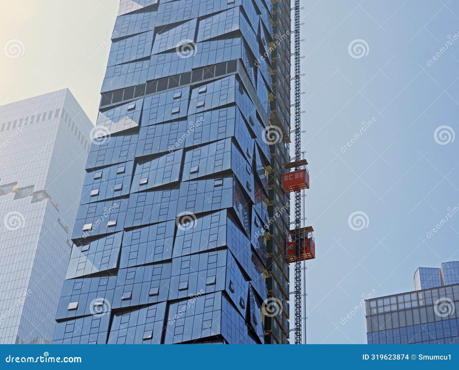 Freight Construction Elevator Ascends To Top of a Skyscraper. Temporary ...