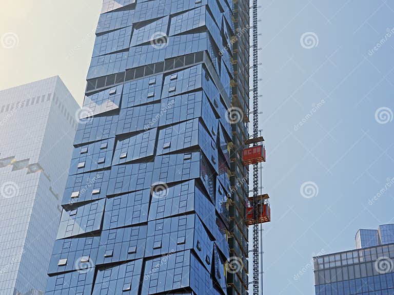 Freight Construction Elevator Ascends To Top of a Skyscraper. Temporary ...