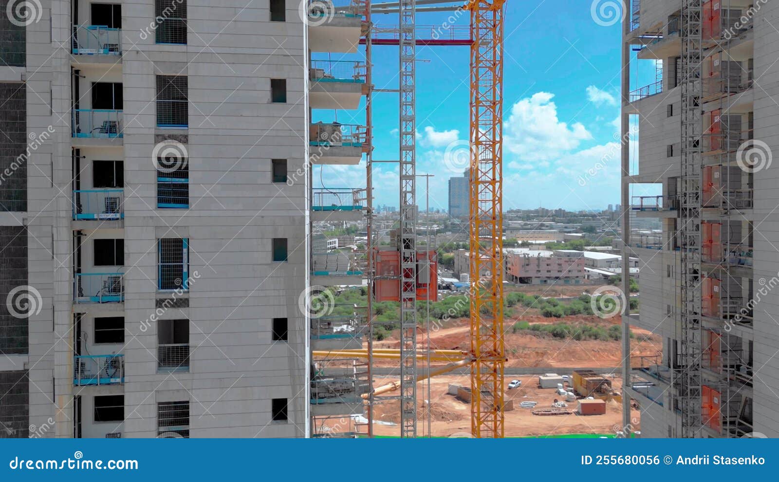 Freight Elevator at the Construction Site of High Rides Up and Down. a ...