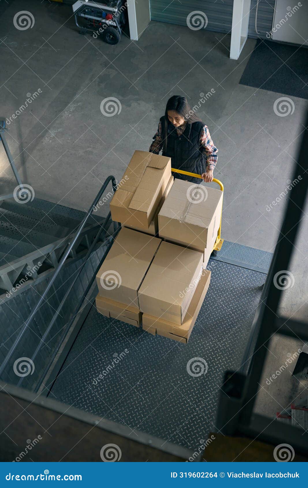 Freight Handler Transporting Goods on Wheeled Cart in Warehouse ...