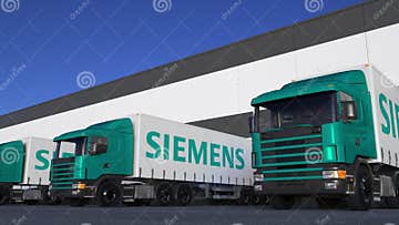 Freight Semi Trucks with Siemens Logo Loading or Unloading at Warehouse ...