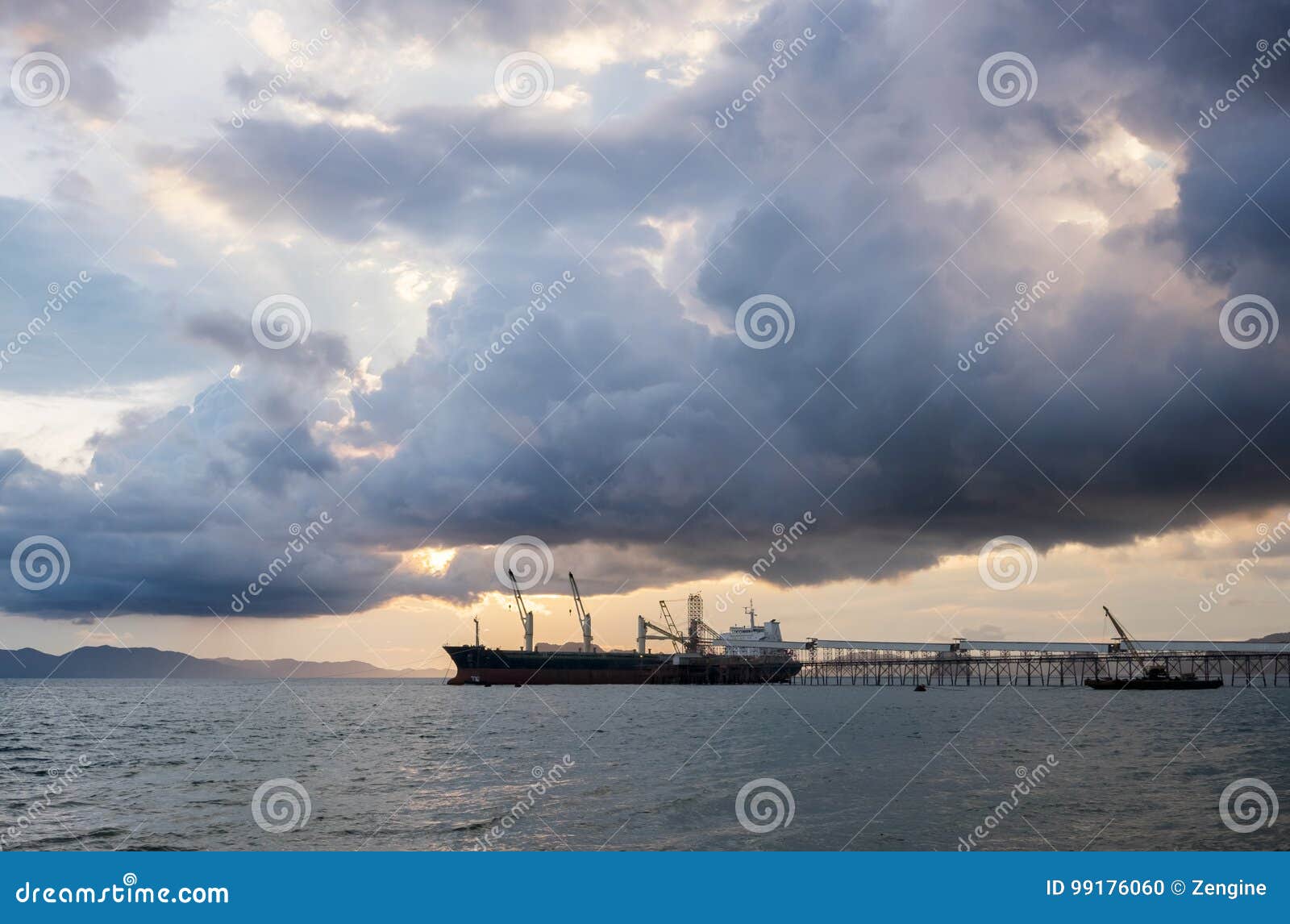 Freight Ship Loading Goods in the Harbour Stock Photo - Image of clouds ...