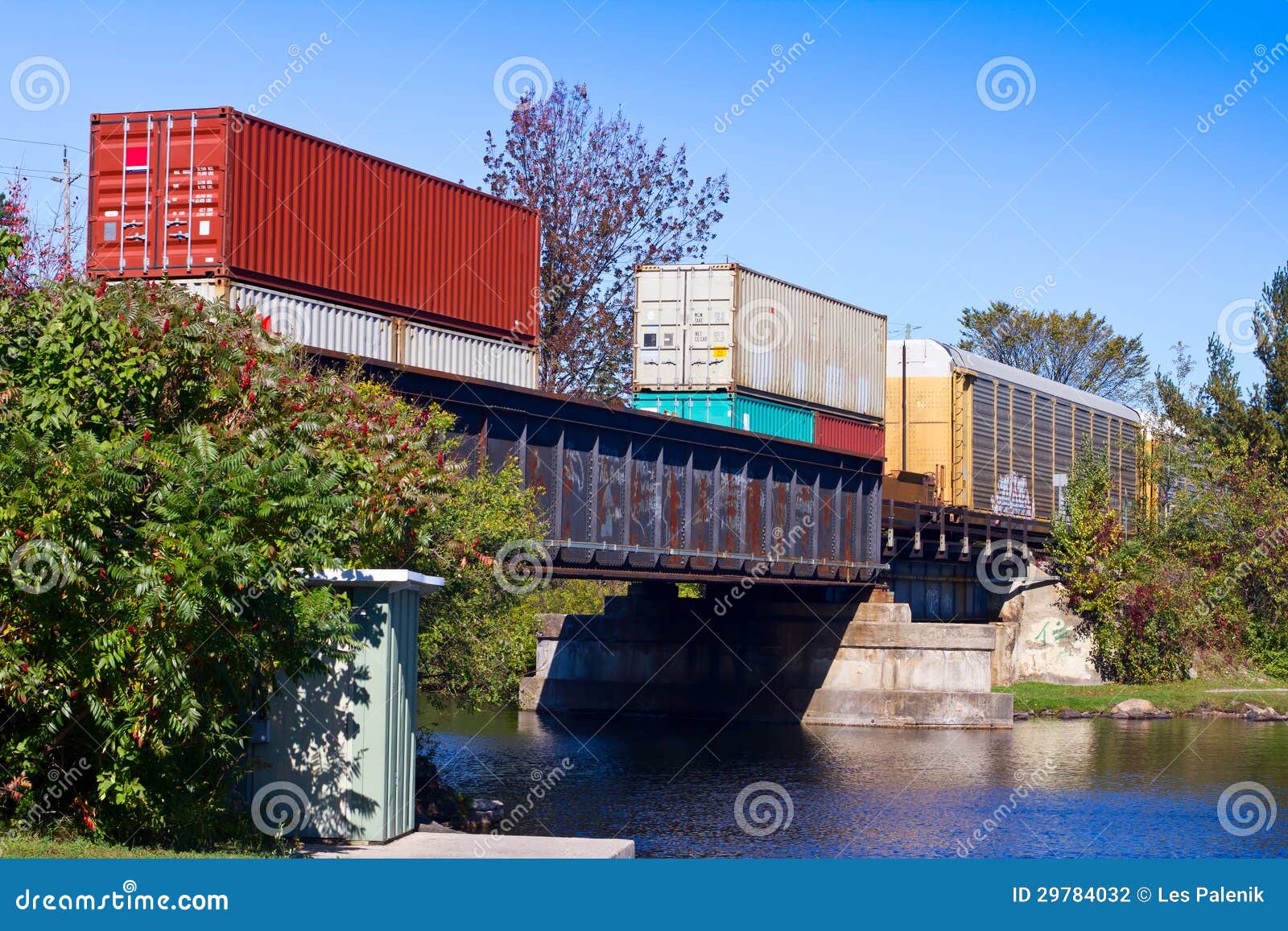 Freight train on a bridge stock photo. Image of bush - 29784032