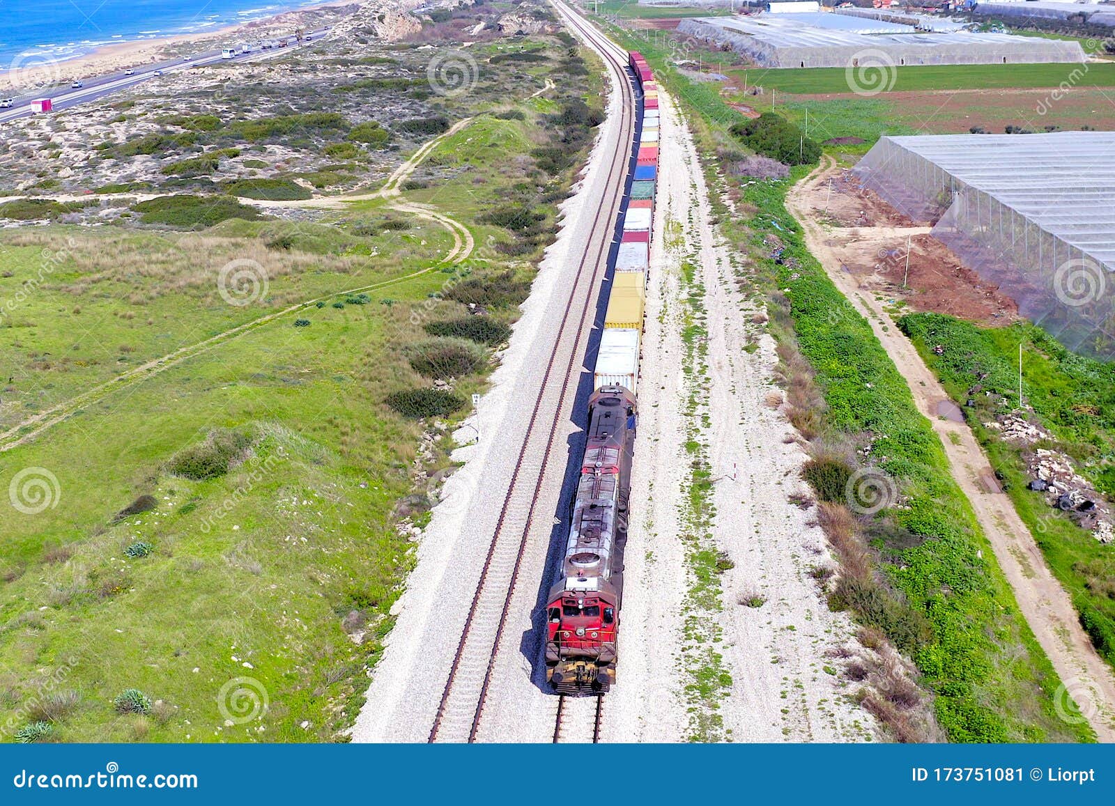 Freight Train Hauling a Long Load of Shipping Containers. Stock Image ...