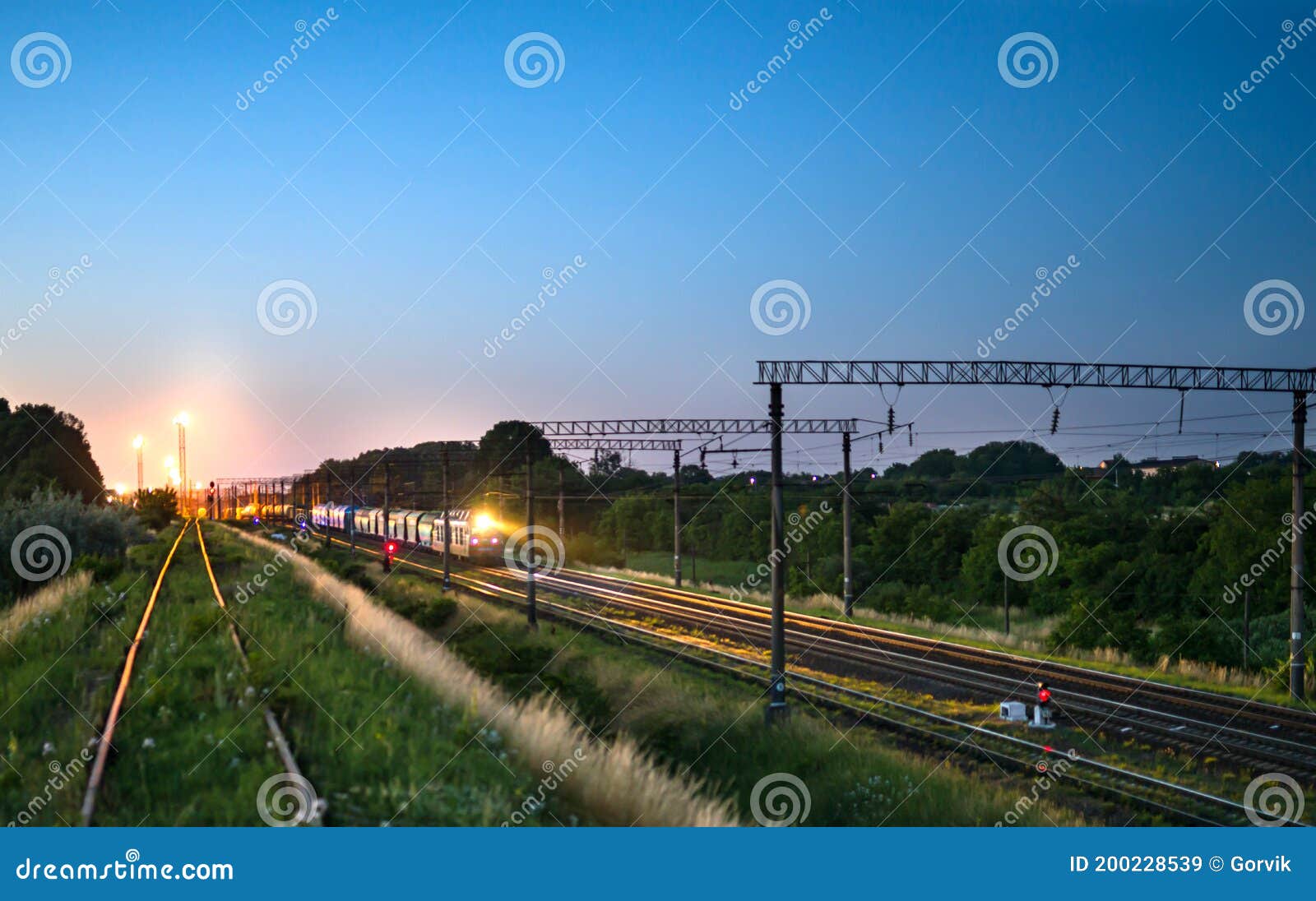 Freight Train with Lights on while Moving in the Evening Stock Image ...