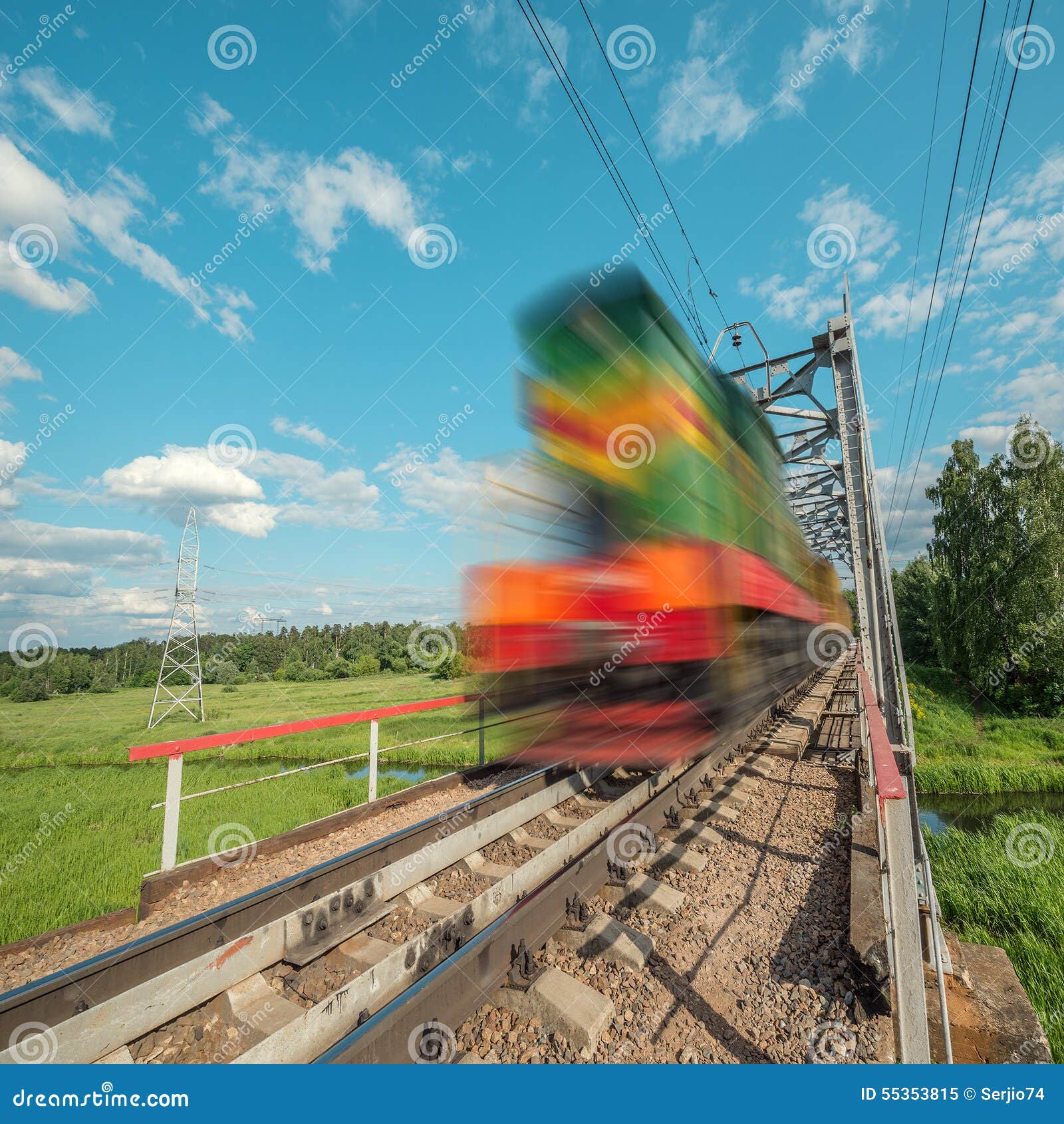 Freight Train Moves Fast on the Railway Bridge. Stock Image - Image of ...