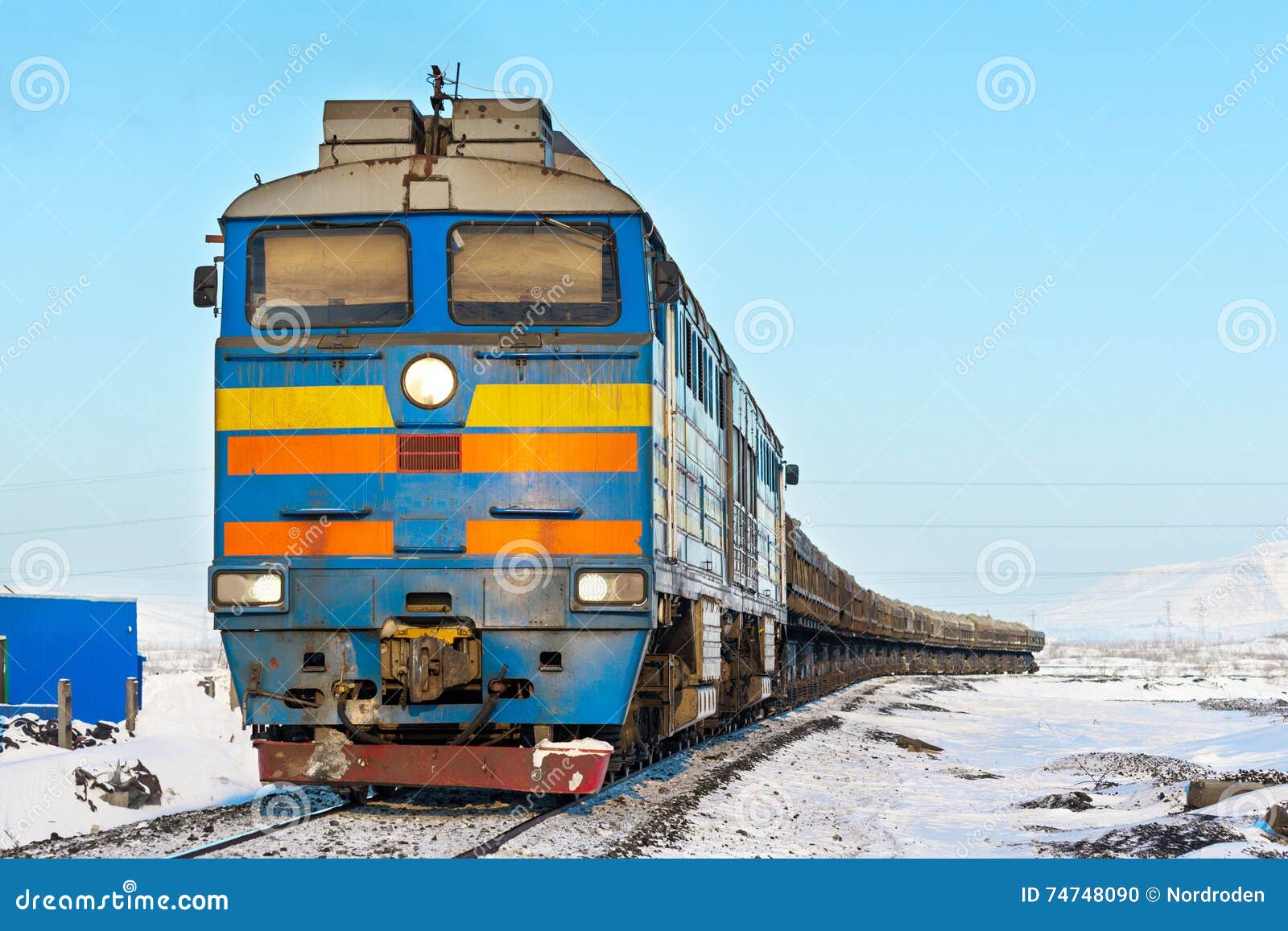Freight Train Moving on Snow-covered Tracks. Stock Photo - Image of ...