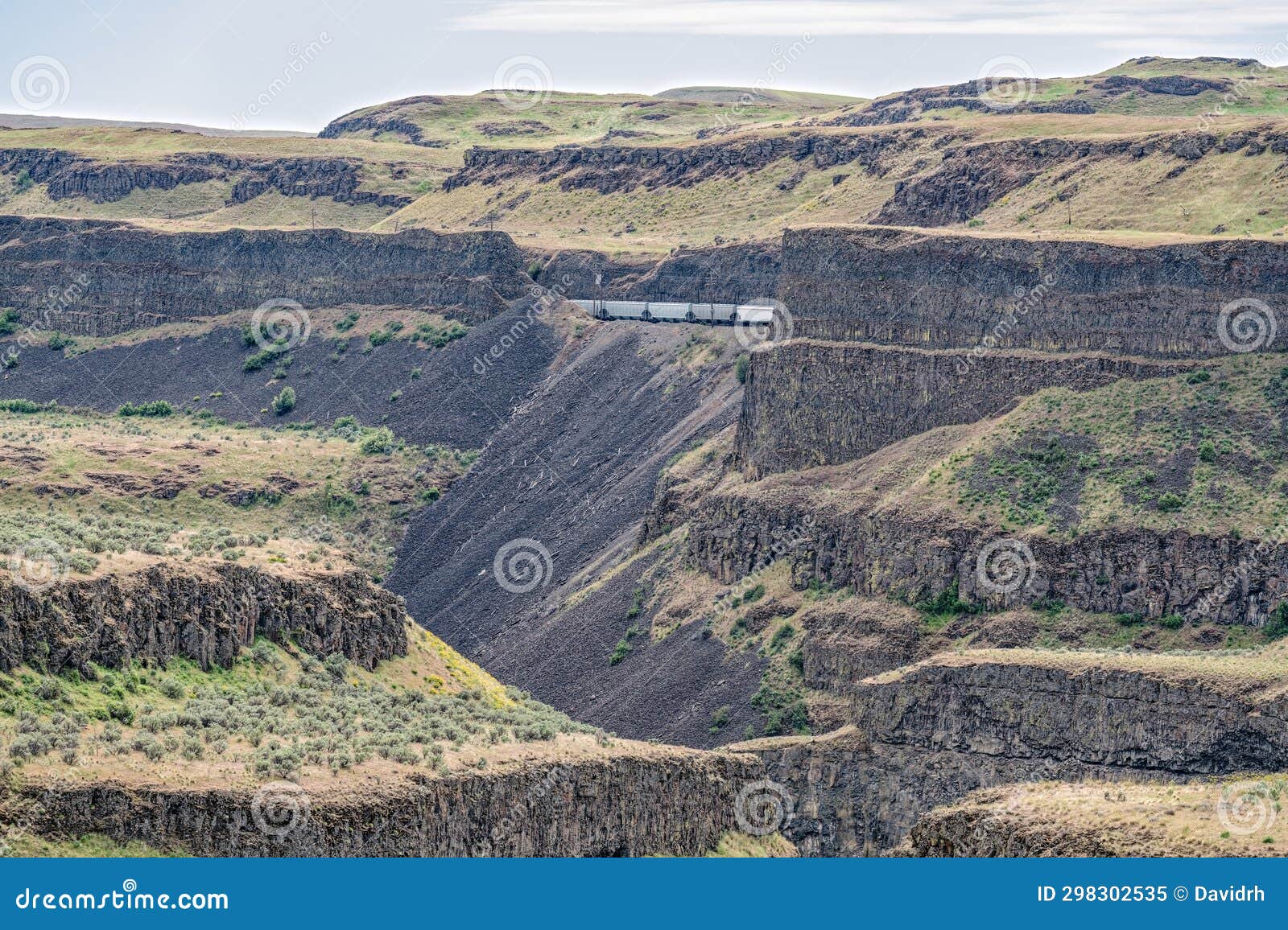 A Freight Train Passes between the Basalt Cliffs of Palouse Falls State ...