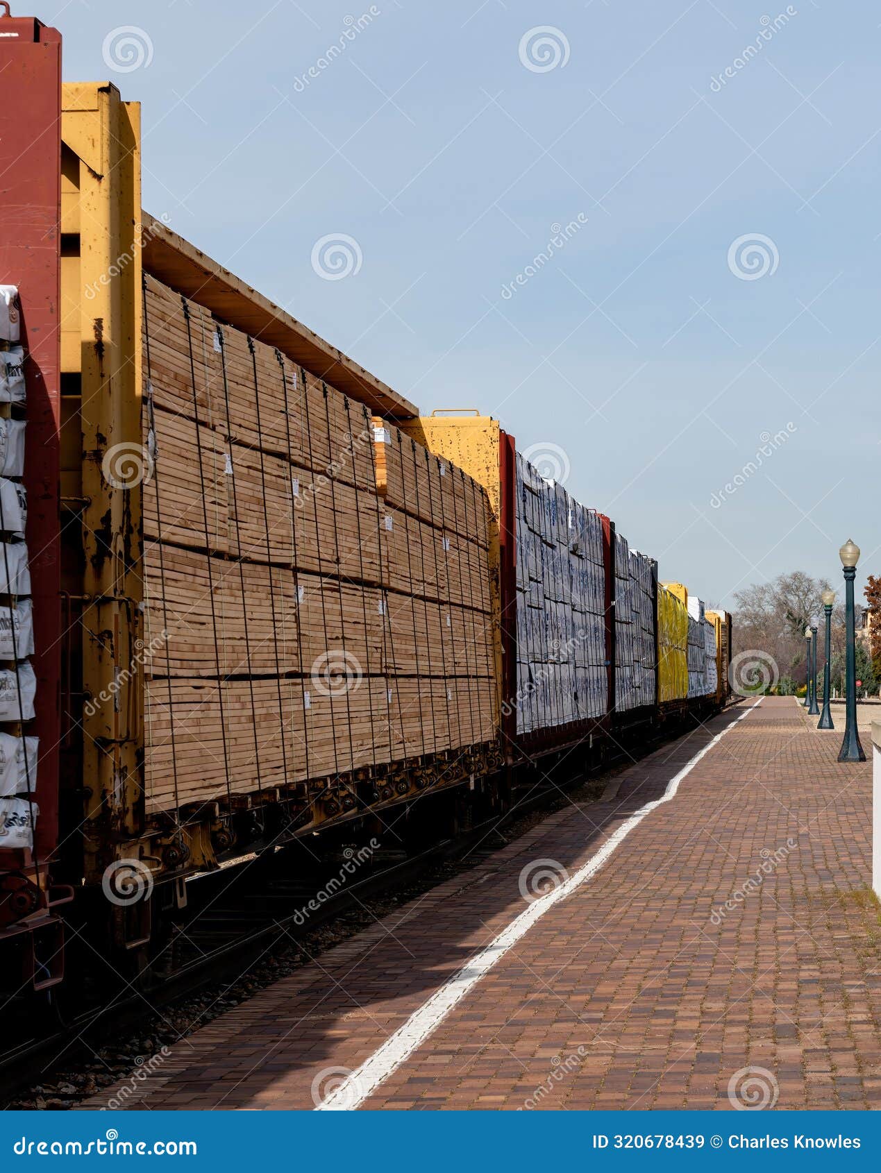 Freight Train Passing Loading Deck of a Depot Stock Image - Image of ...