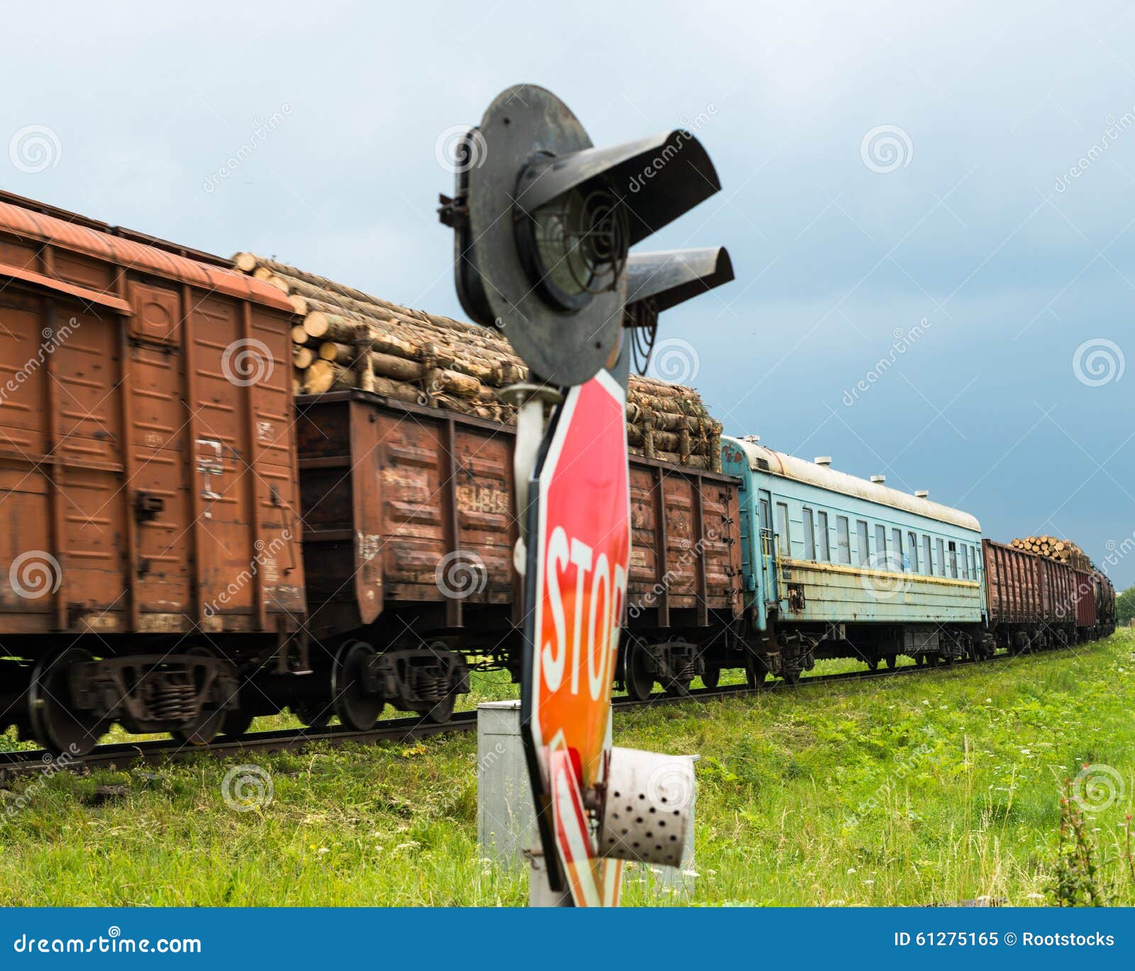 Freight Train Passing the Railroad Crossing Stock Image - Image of ...