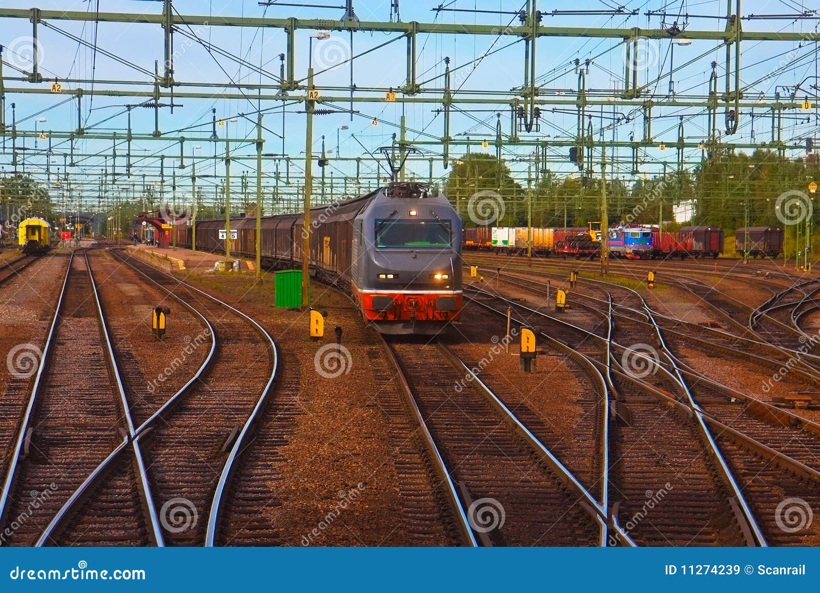 Freight Train Passing Railway Station Stock Image - Image of speed ...