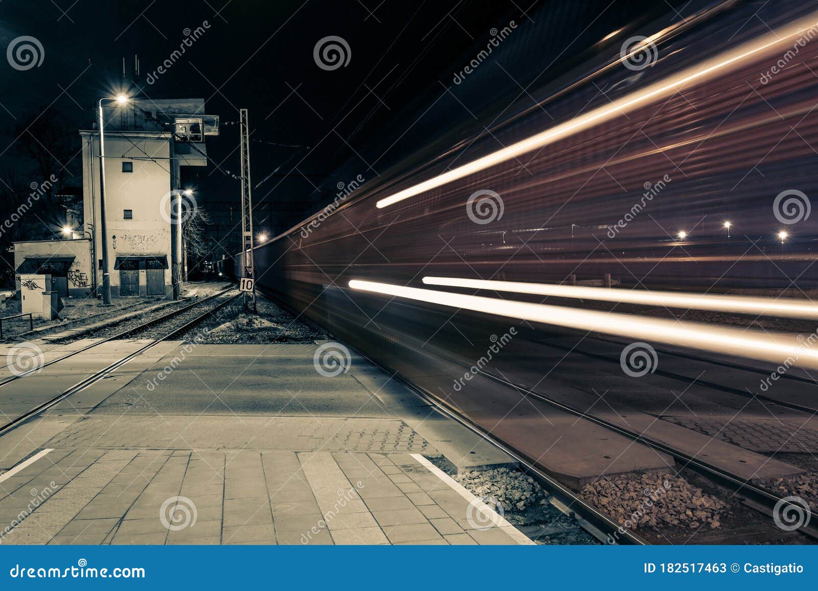 A Freight Train Passing through the Train Station at Night Stock Image ...