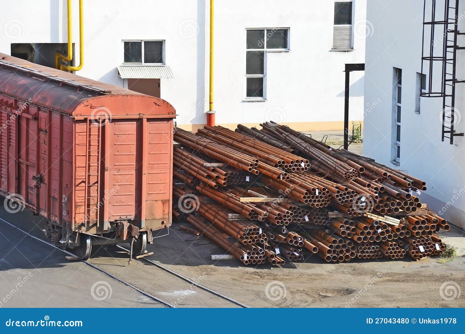 Freight Train and Pipe Stack Stock Photo - Image of railroad, cargo ...