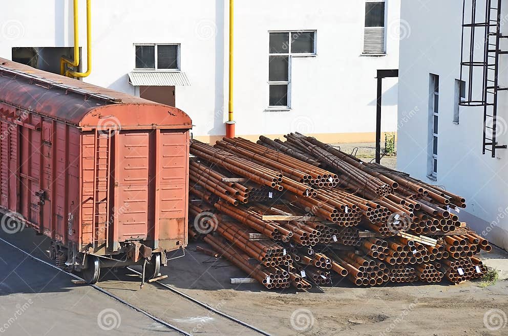 Freight Train and Pipe Stack Stock Photo - Image of railroad, cargo ...