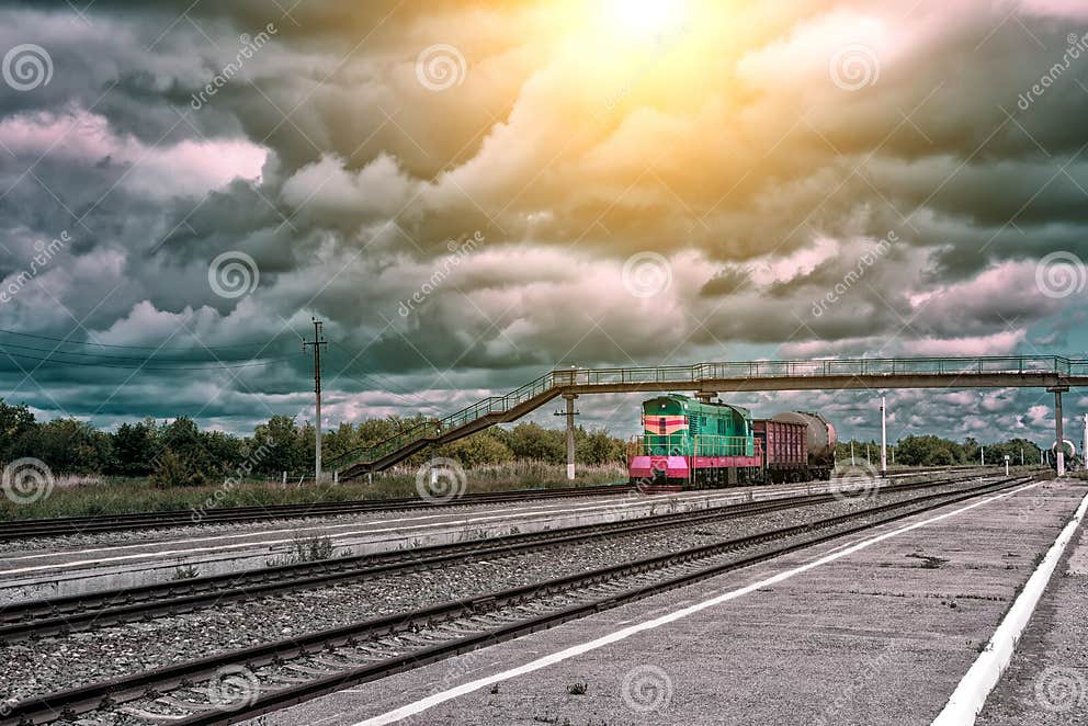 Freight Train at Railway Station Stock Photo - Image of dramatic, empty ...