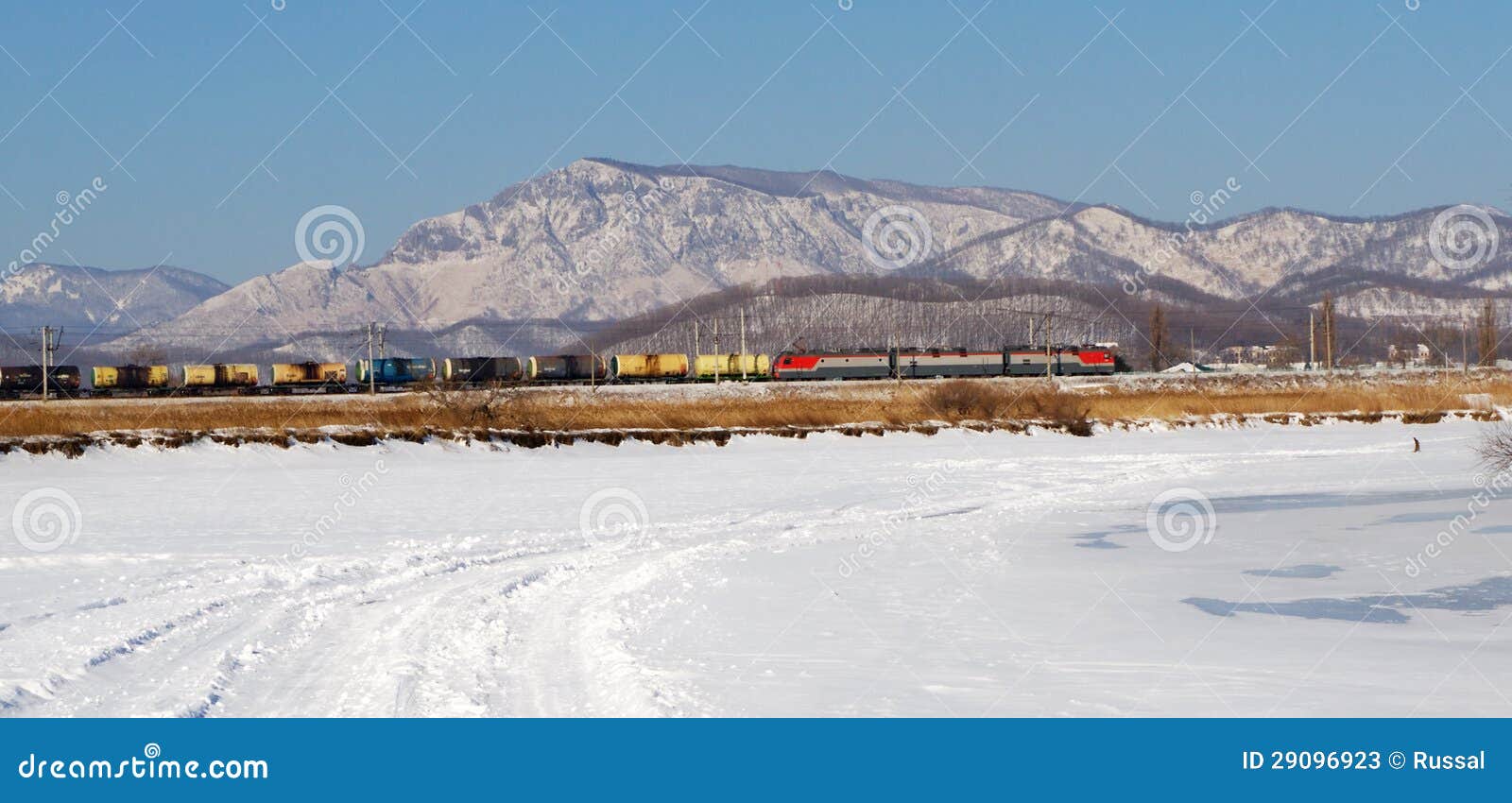 Freight Train Rides on a Background of Mountains Stock Image - Image of ...