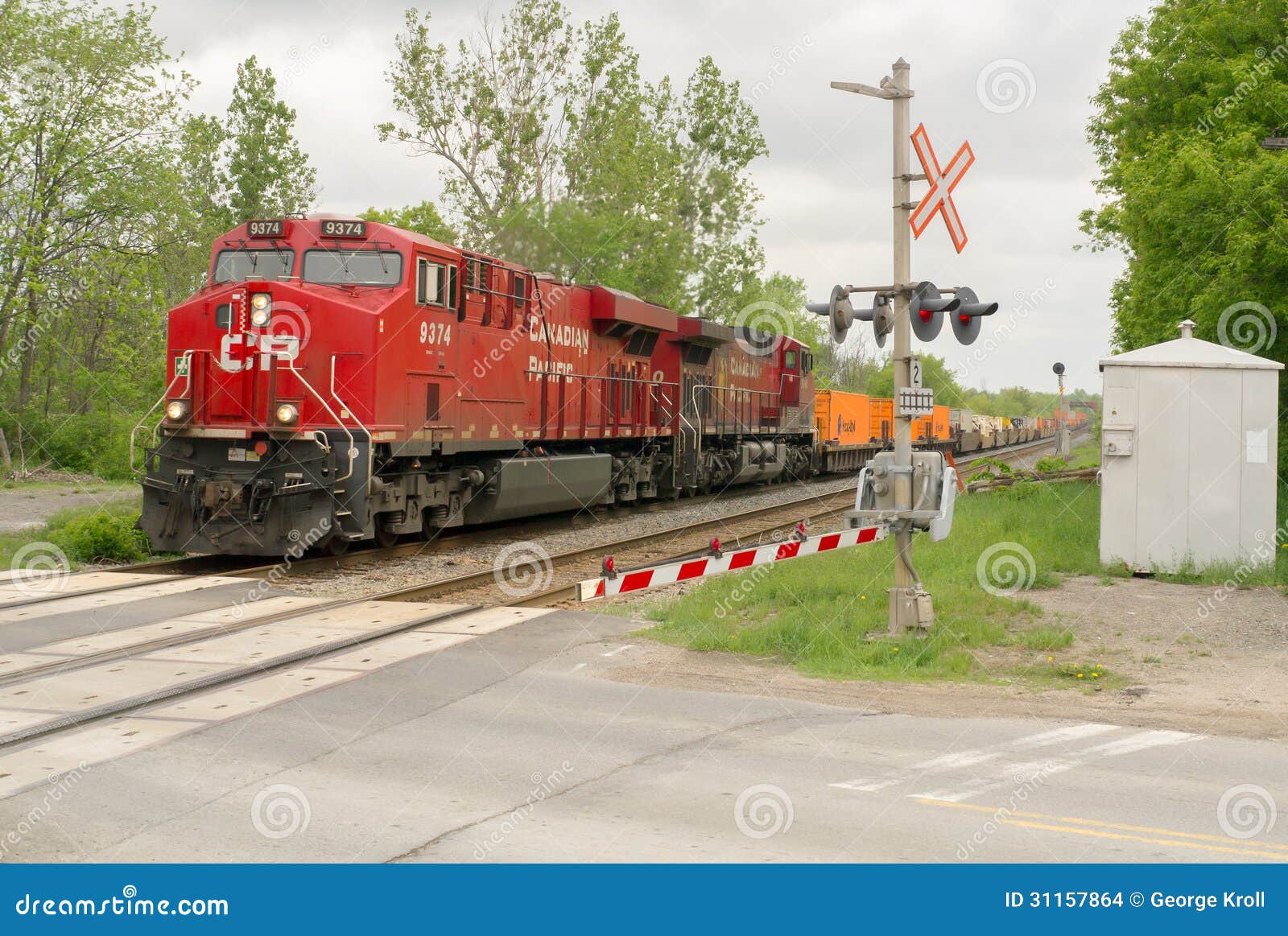 Freight Train at Road Crossing Editorial Stock Image - Image of ...