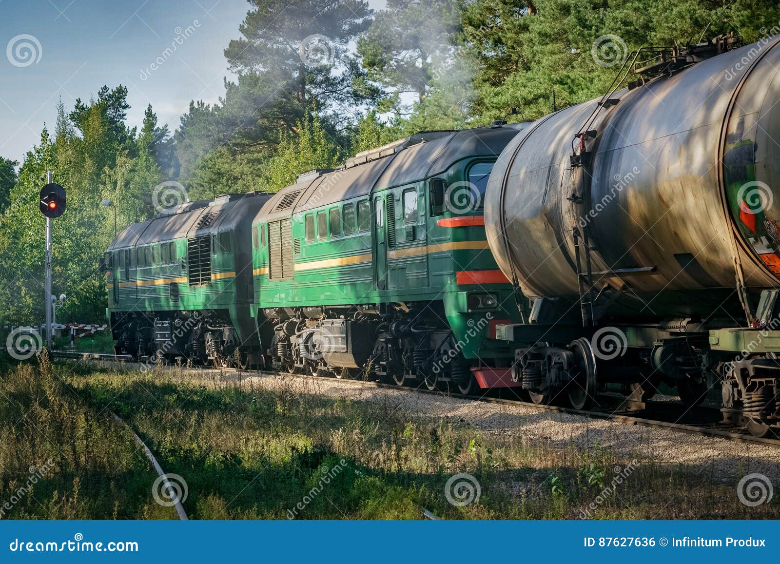 A Freight Tank Train Passes Through The Mountain Railway Station ...