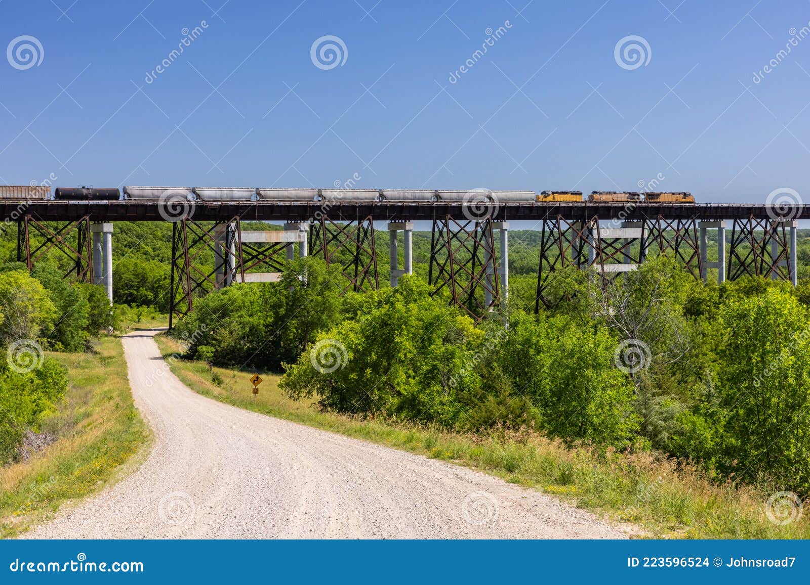 Freight Train Traveling Across High Trestle Bridge Stock Photo - Image ...
