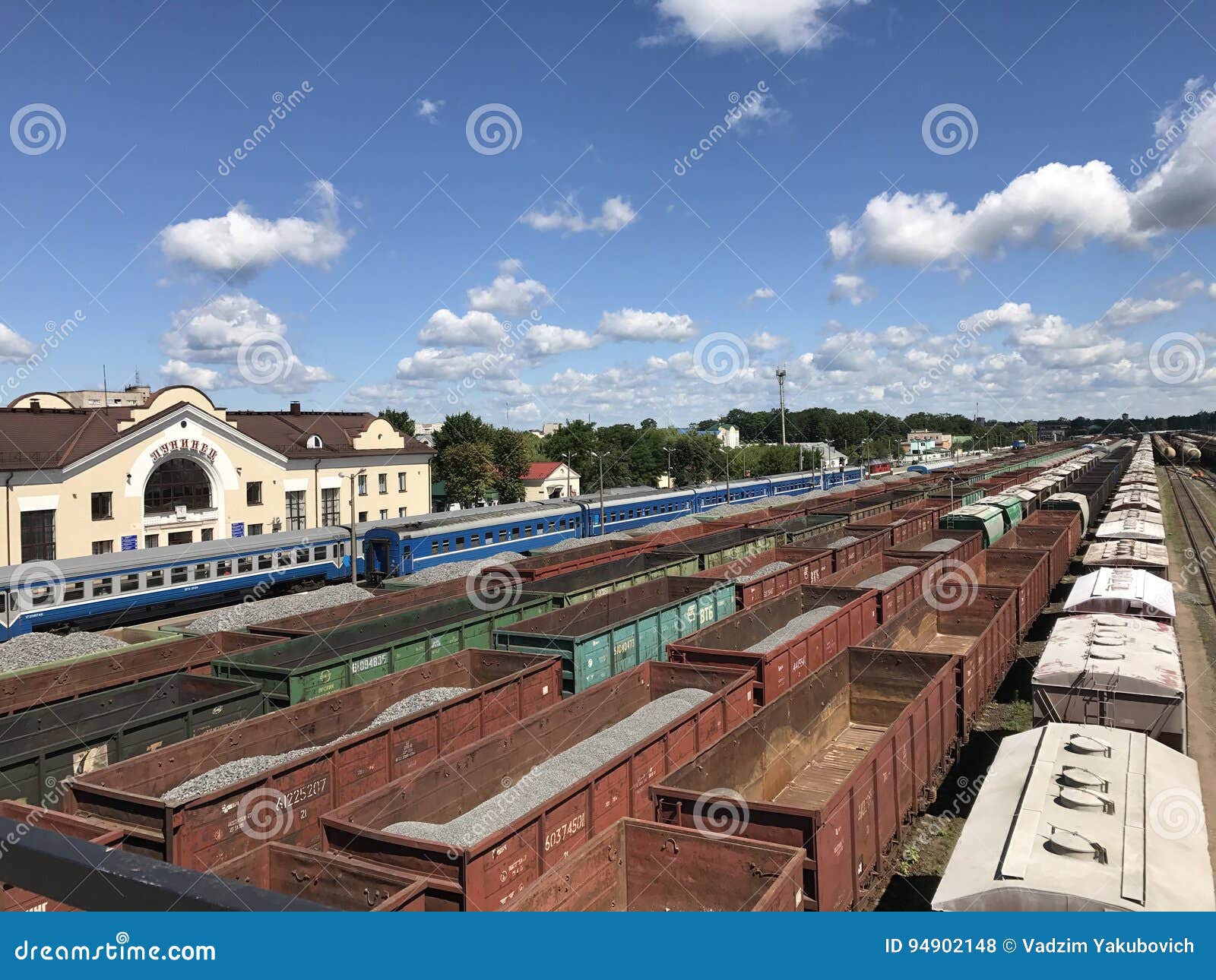 Freight Trains at the Railway Station. Open Freight Wagons with Cargo ...