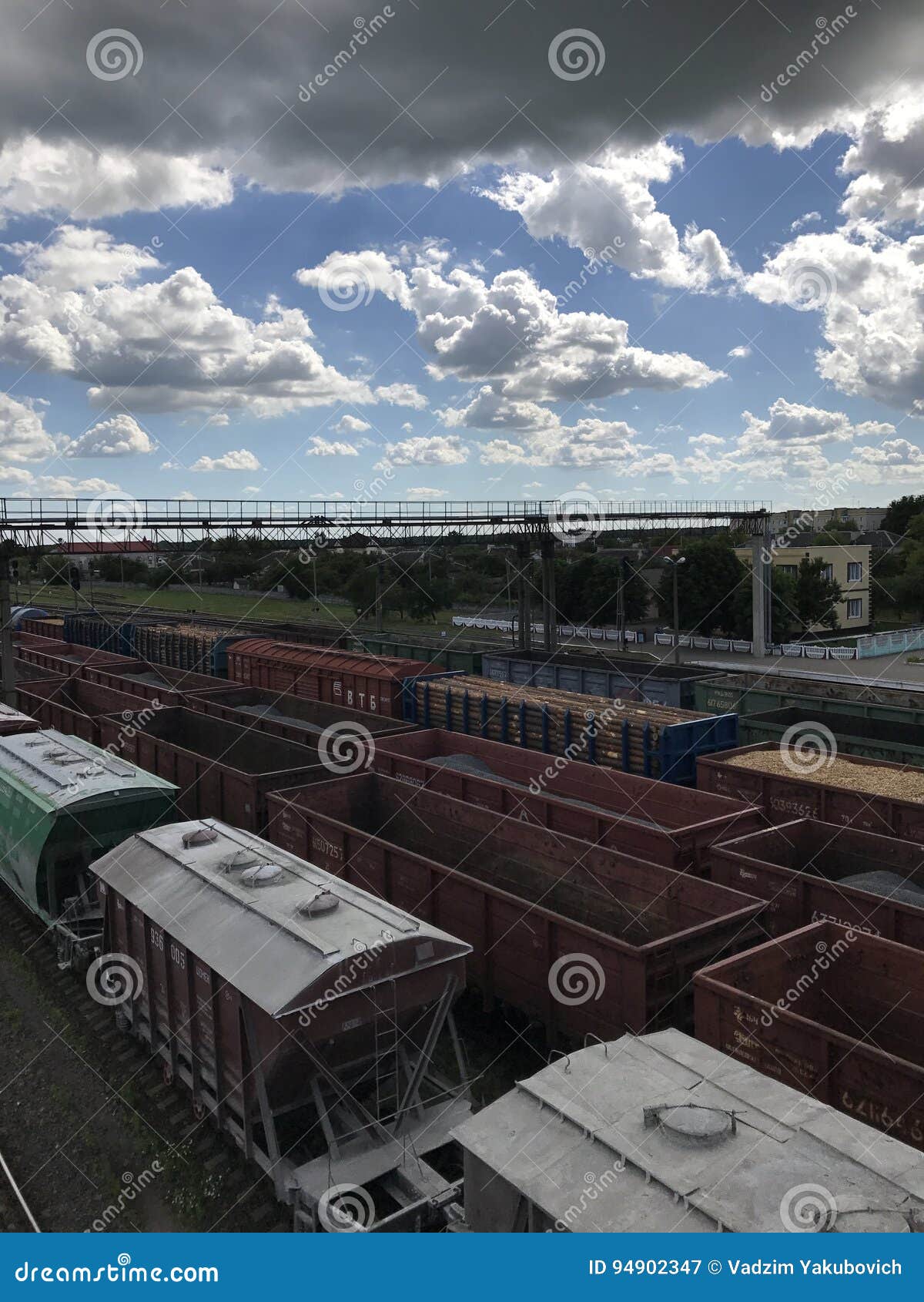 Freight Trains at the Railway Station. Open Freight Wagons with Cargo ...